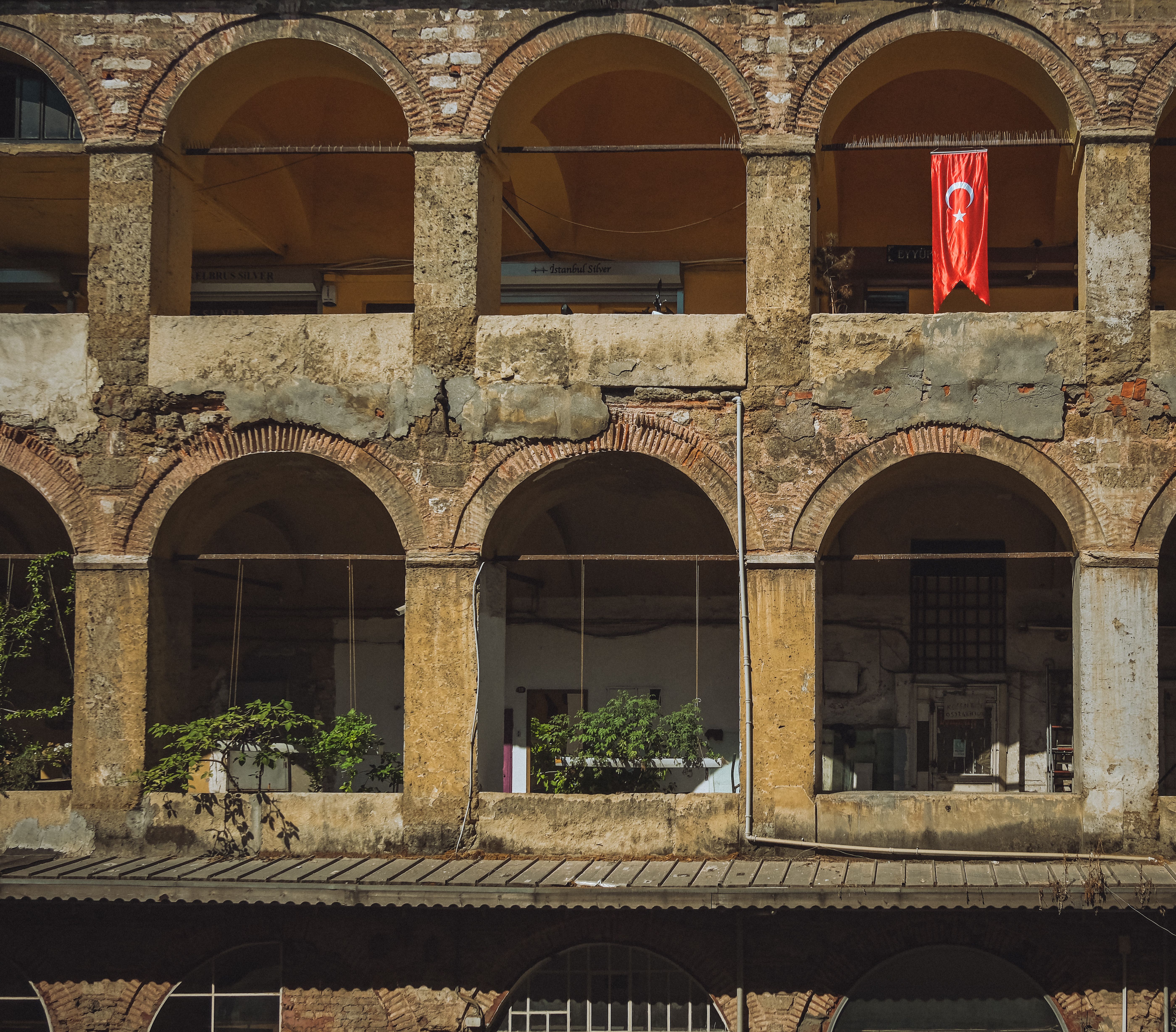 Historic Arched Building in Istanbul with Turkish Flag · Free Stock Photo