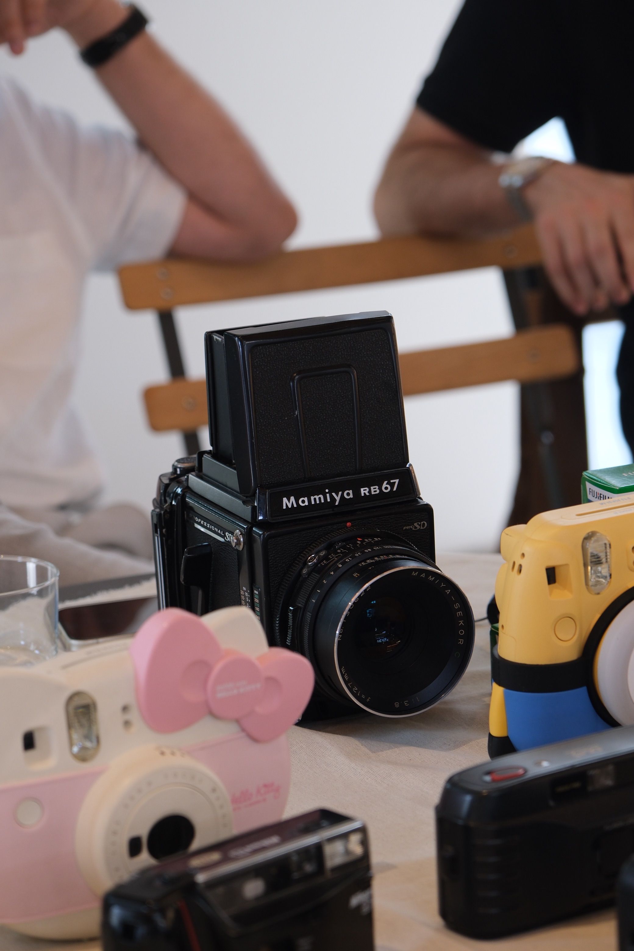 Vintage Mamiya RB67 Camera on Table with Others · Free Stock Photo