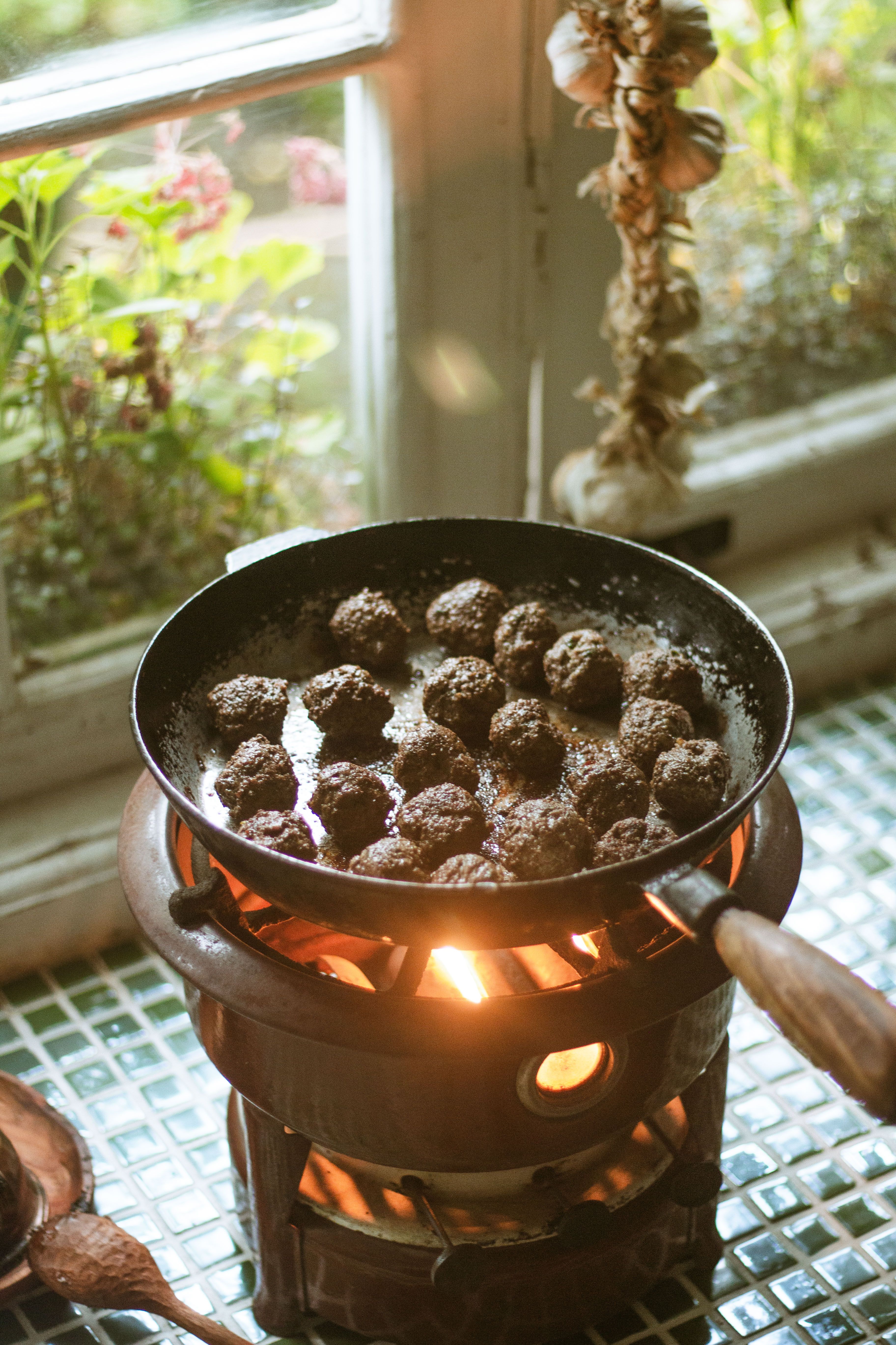 Cozy Indoor Cooking Scene with Meatballs · Free Stock Photo