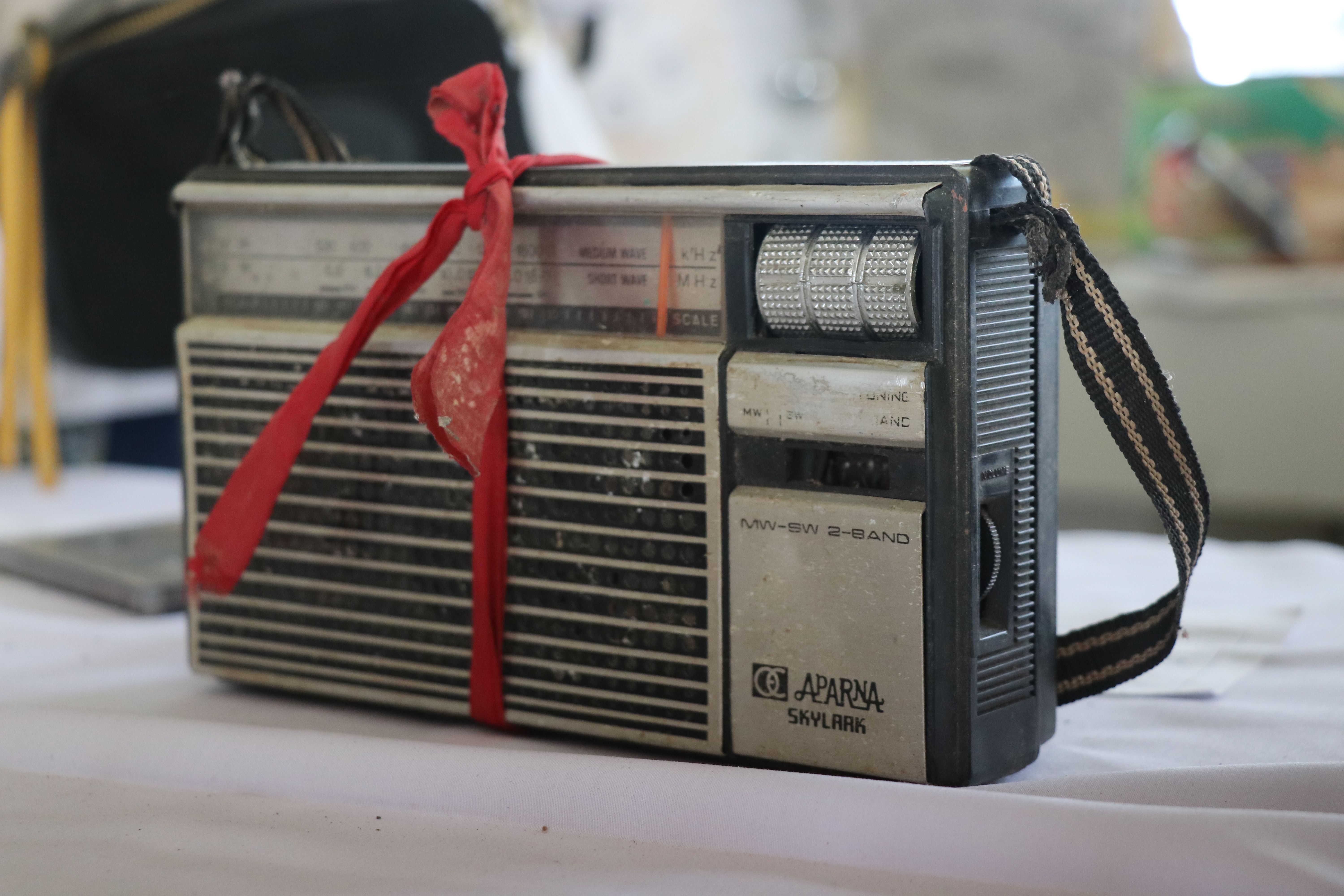 Vintage Portable Radio with Red Ribbon Accent · Free Stock Photo