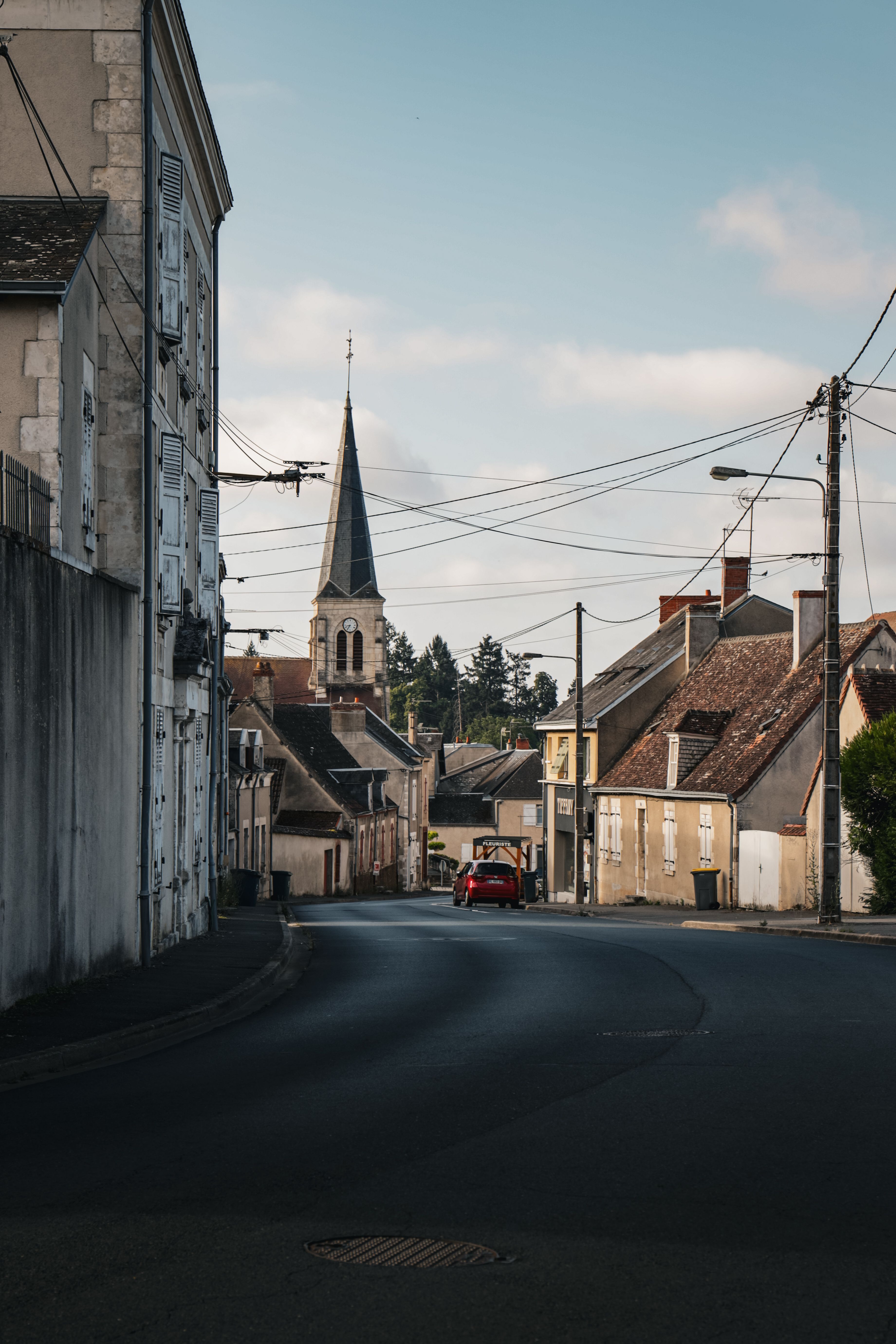 Charming French Village Street with Church View · Free Stock Photo