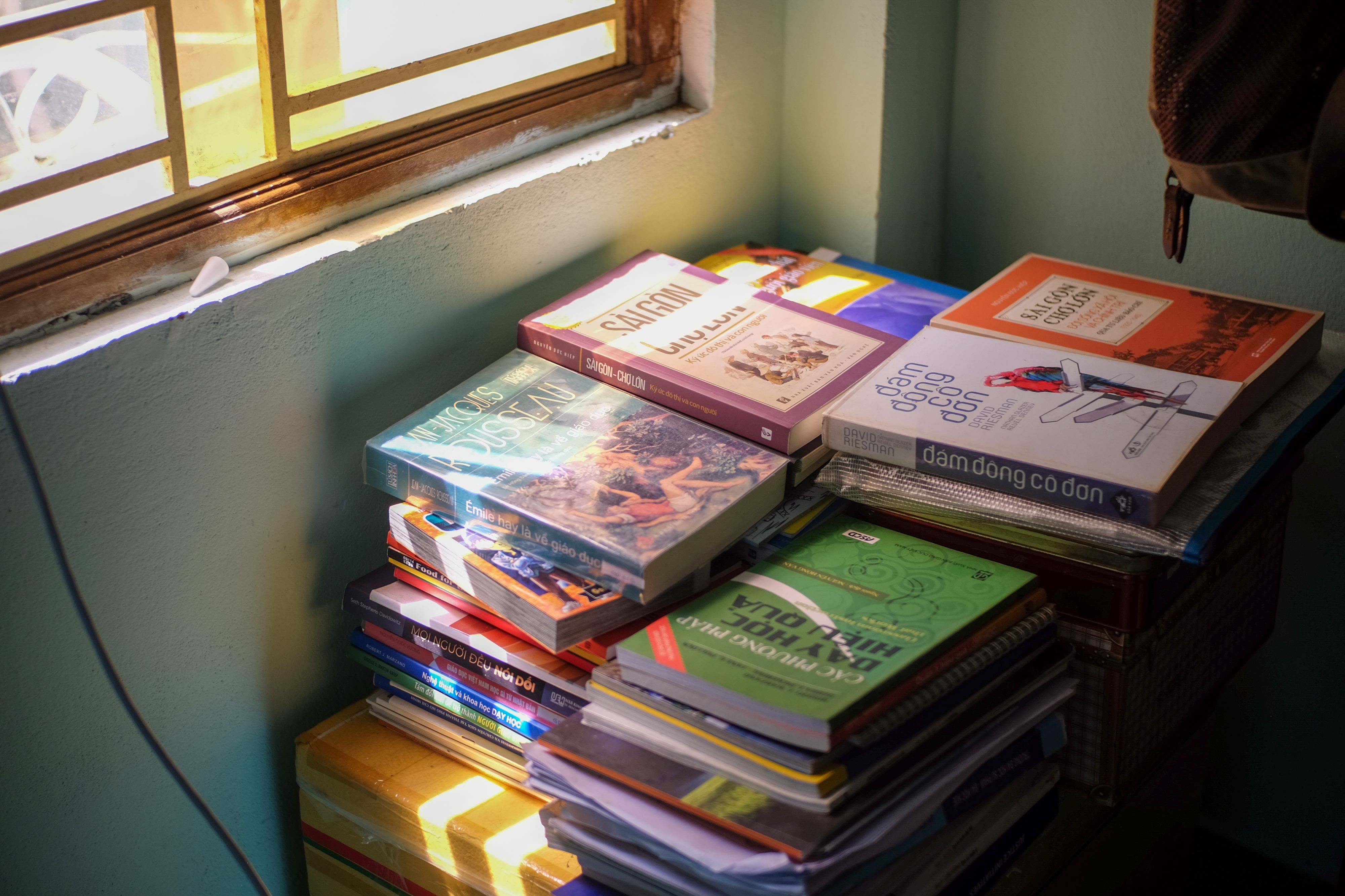 Stack of Books by Sunny Window in Hue, Vietnam · Free Stock Photo