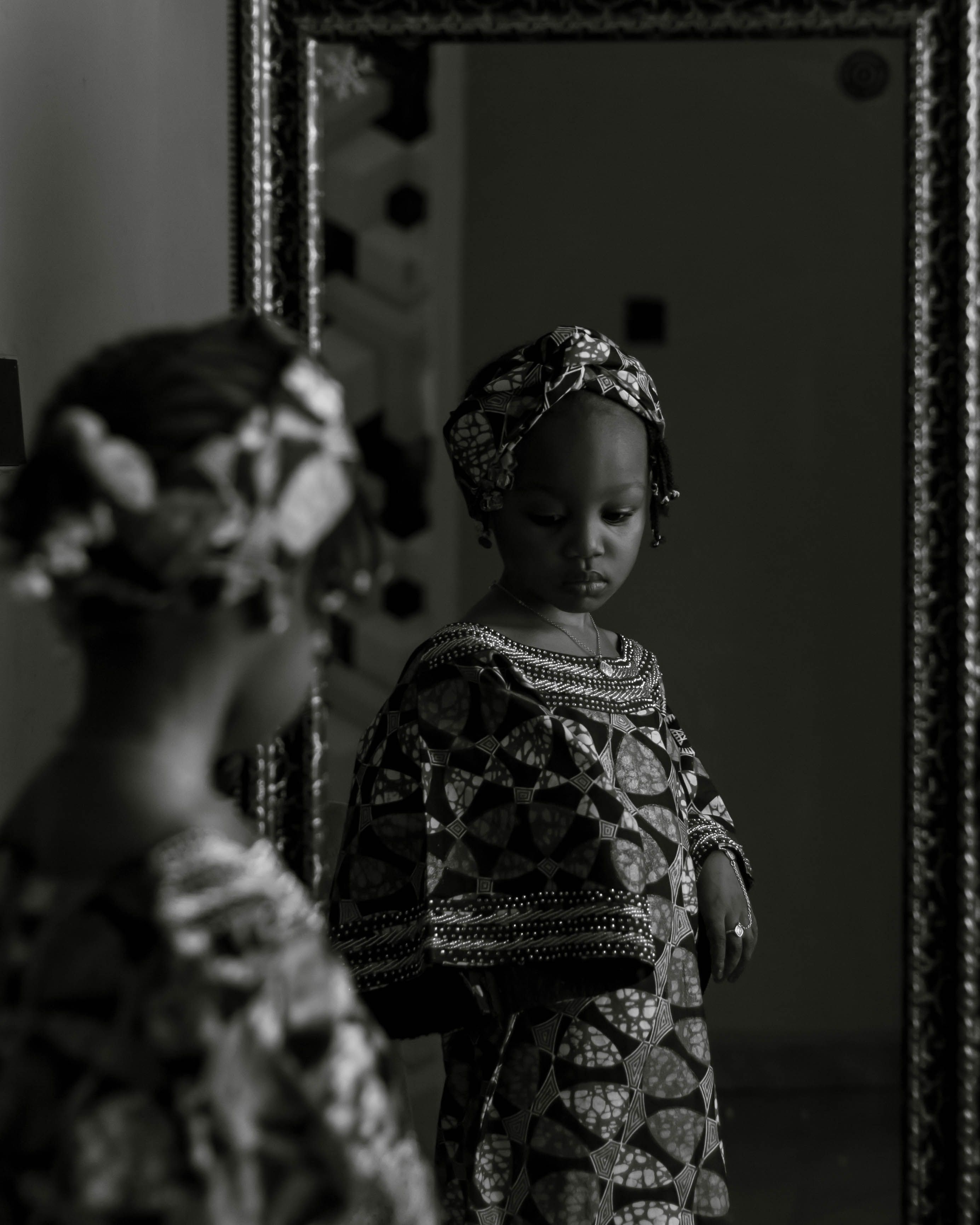 Young Child in Traditional African Dress Reflection · Free Stock Photo