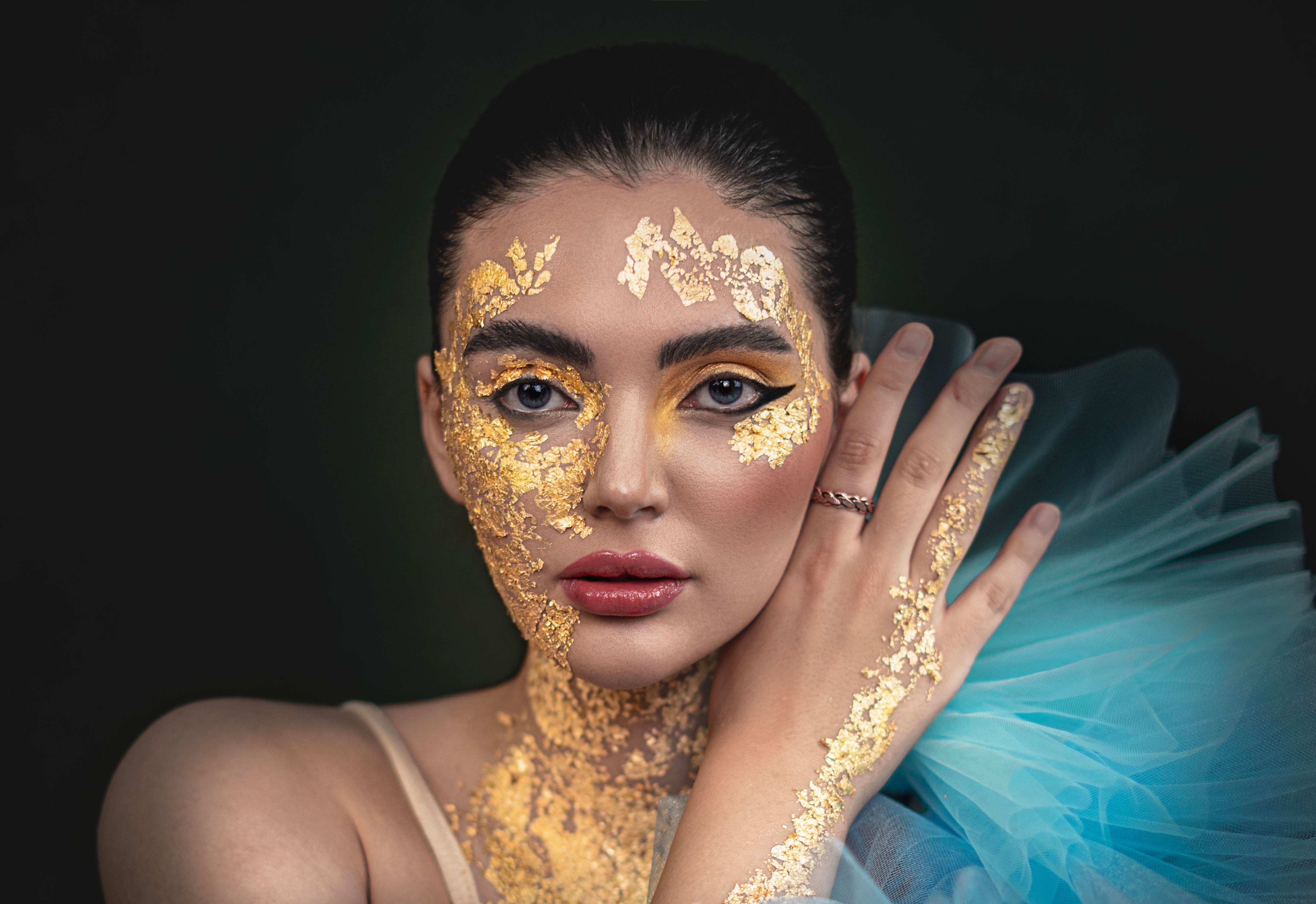 Elegant Woman with Gold Leaf Face Art · Free Stock Photo