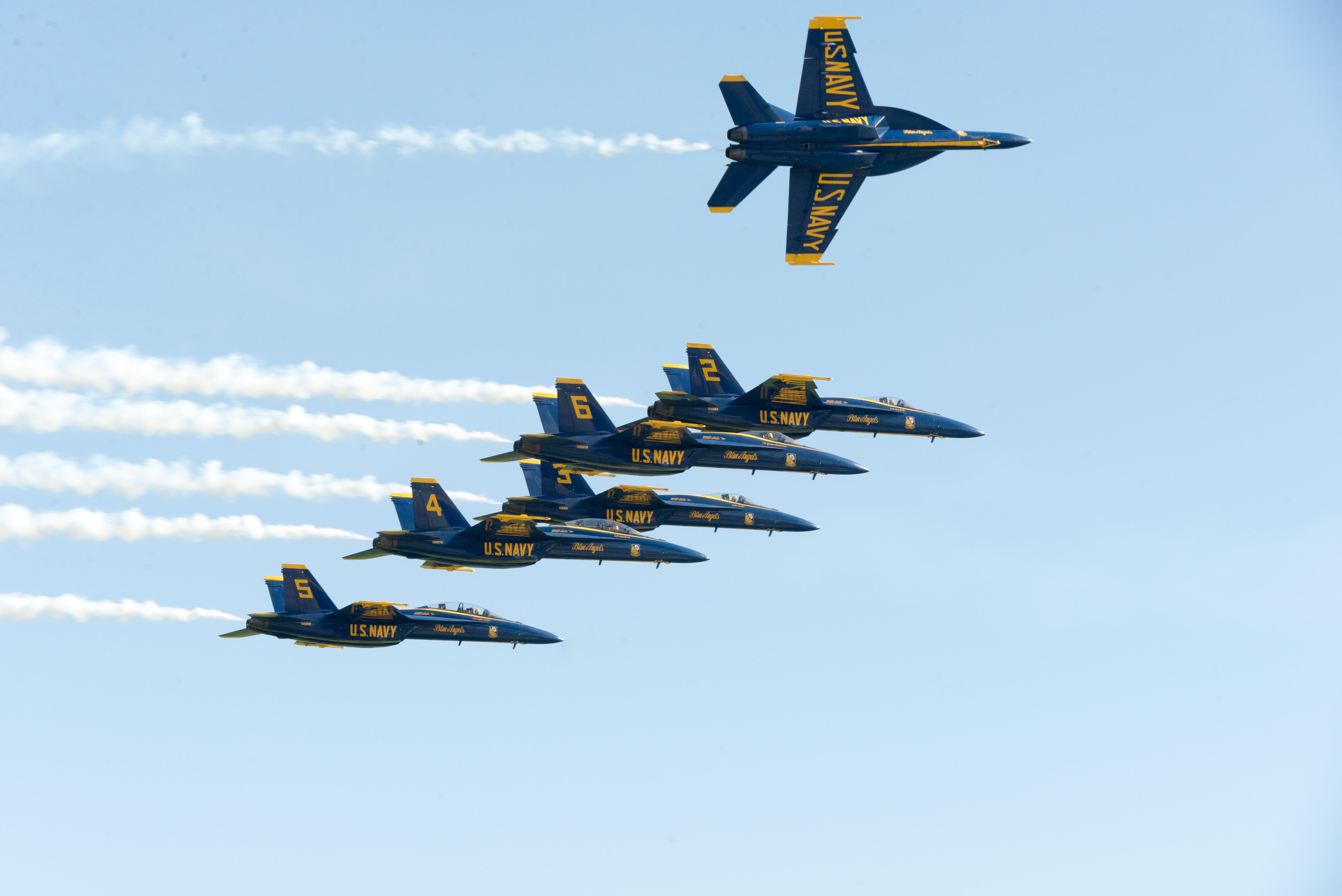 Blue and Yellow Jet Plane in Mid Air · Free Stock Photo