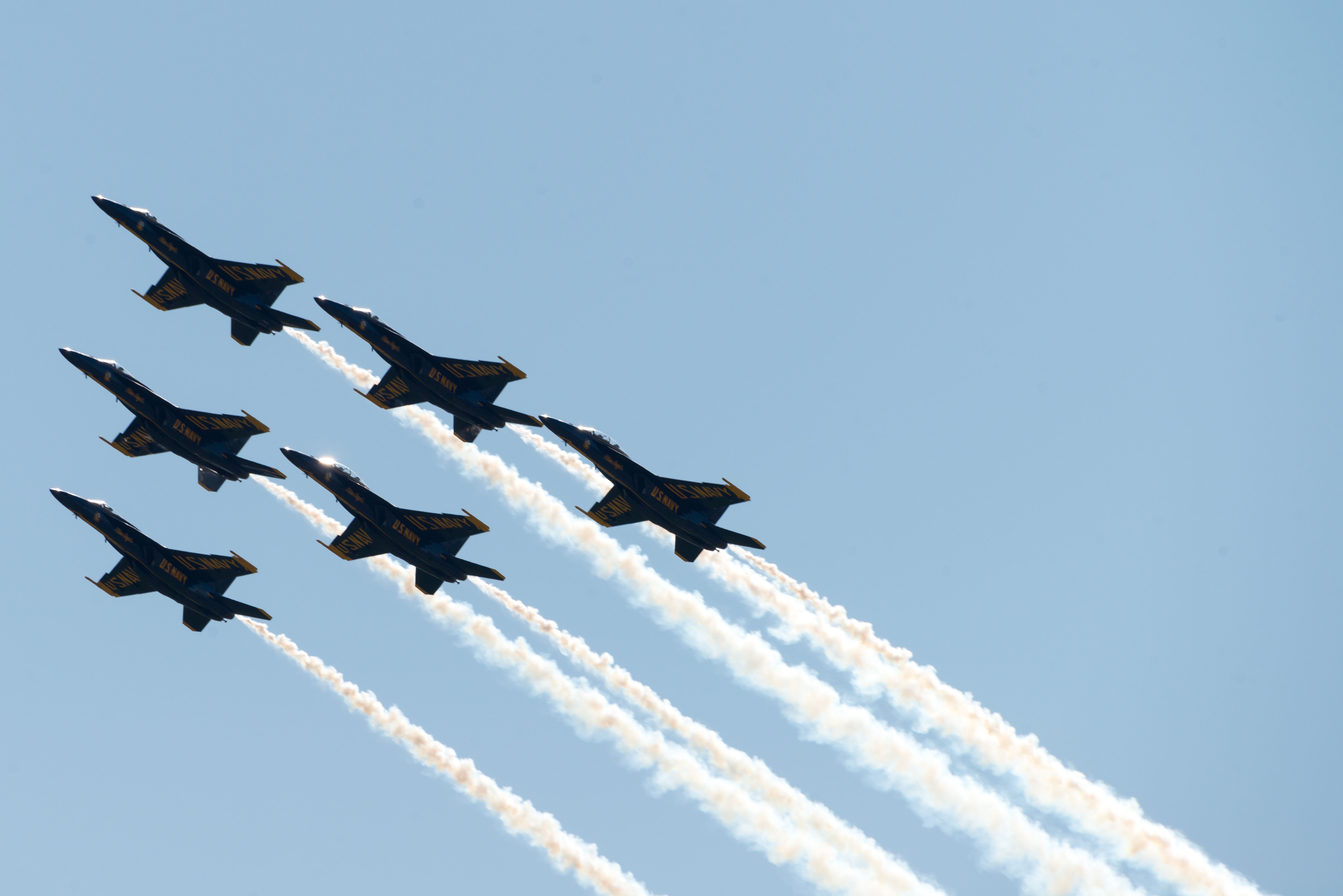 Blue and Yellow Jet Plane in Mid Air · Free Stock Photo