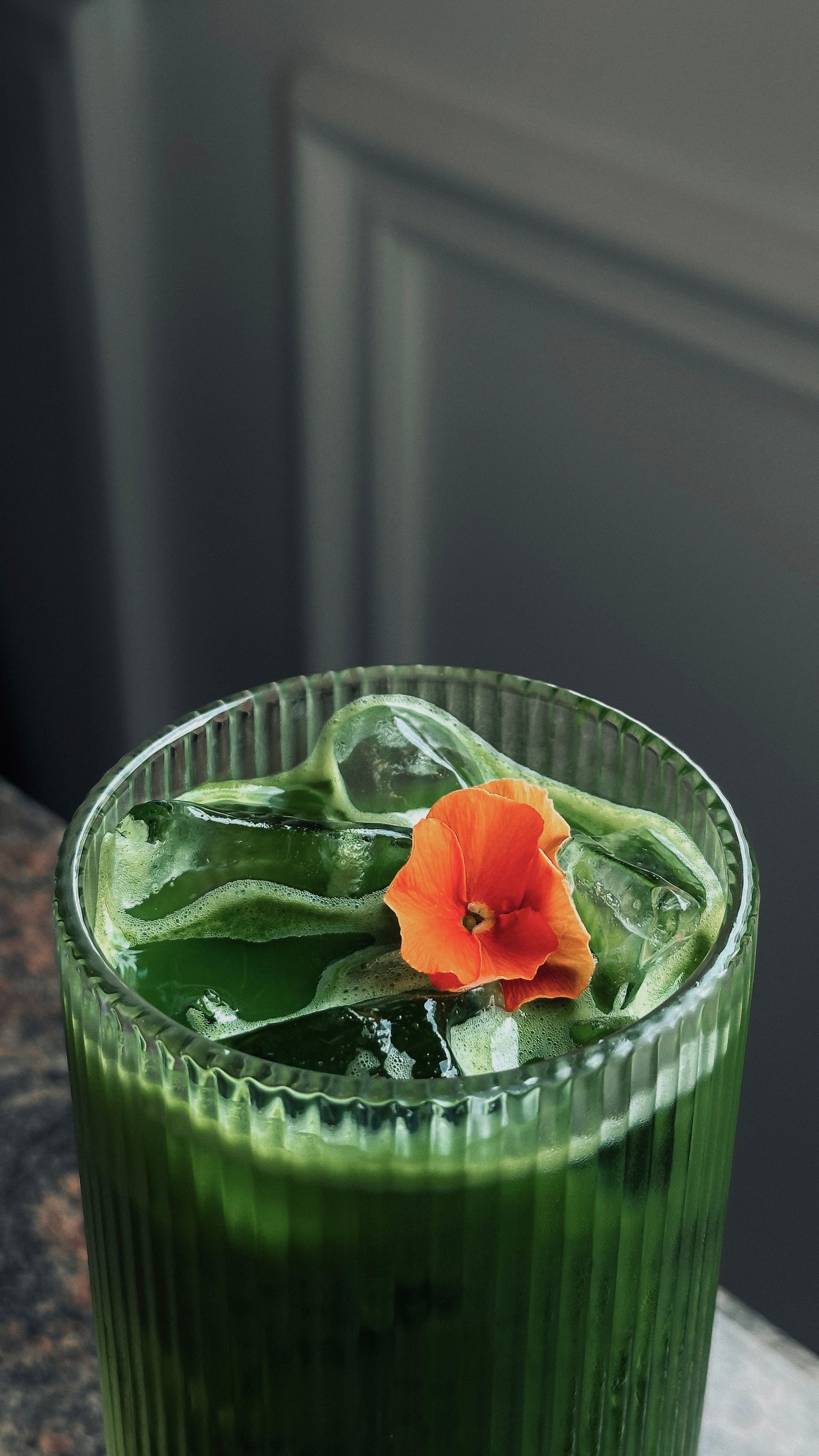 Refreshing Matcha Tea with Ice and Edible Flower · Free Stock Photo