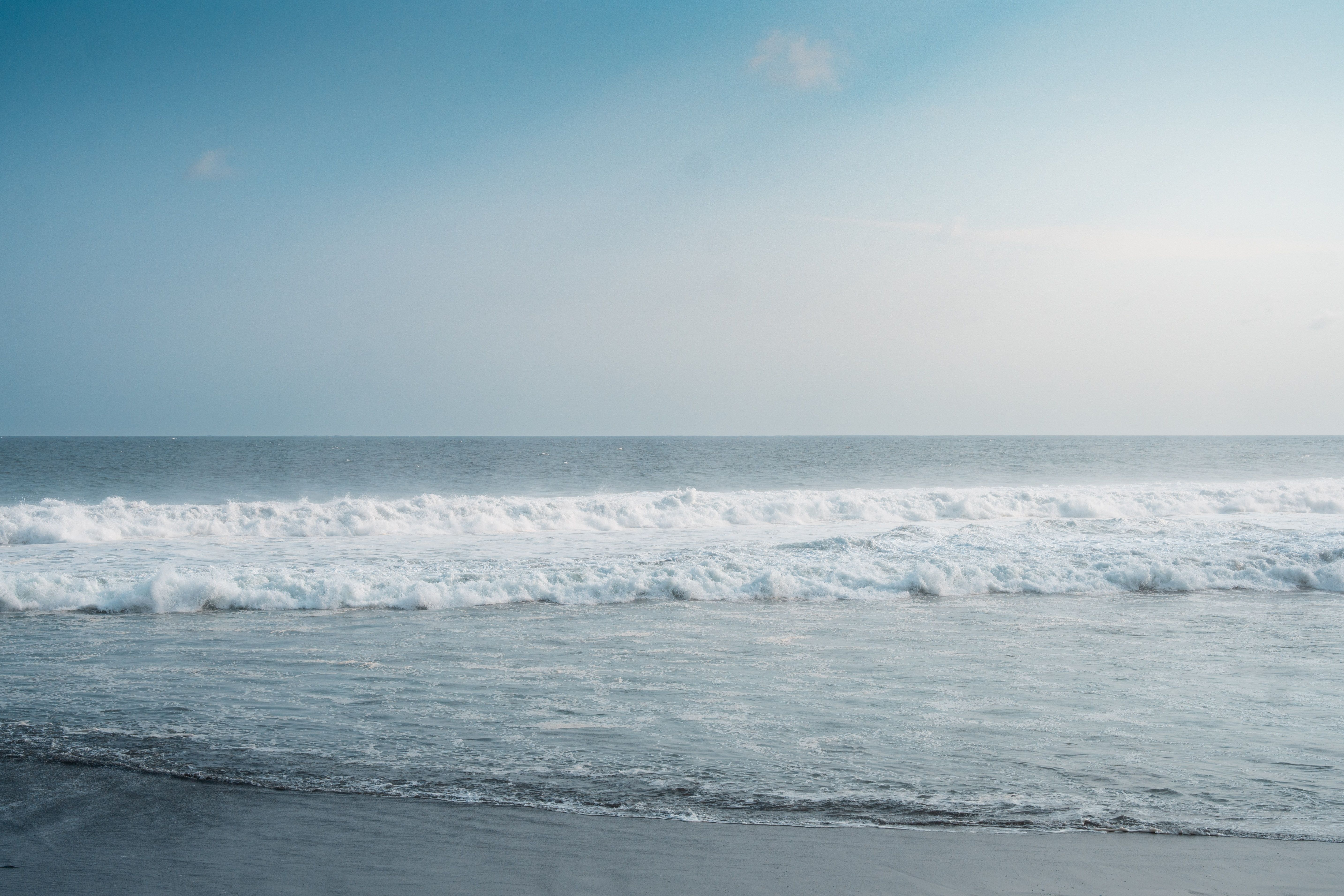 Calm Water on Seashore at Daytime · Free Stock Photo
