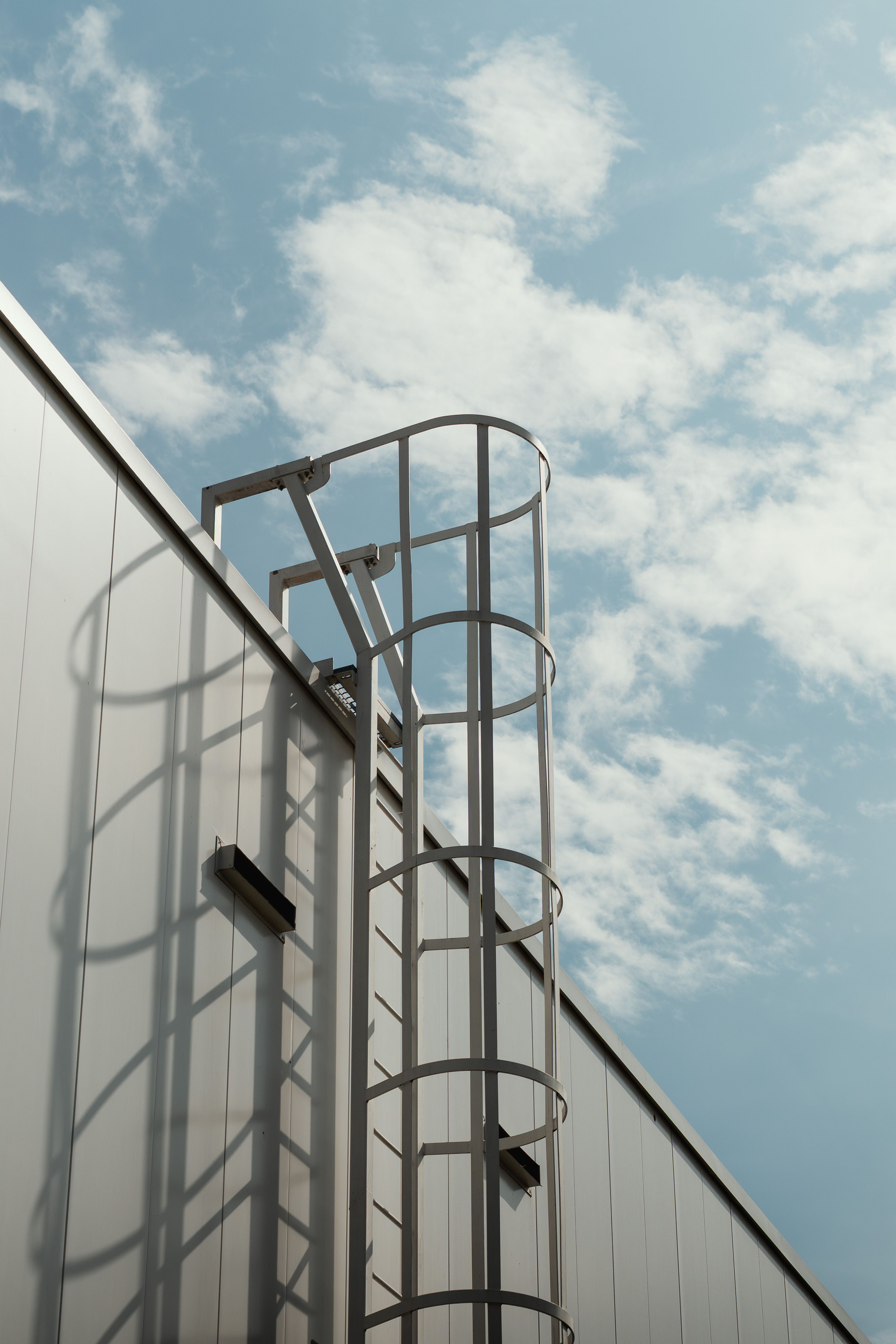 Industrial Ladder Against Blue Sky Perspective · Free Stock Photo