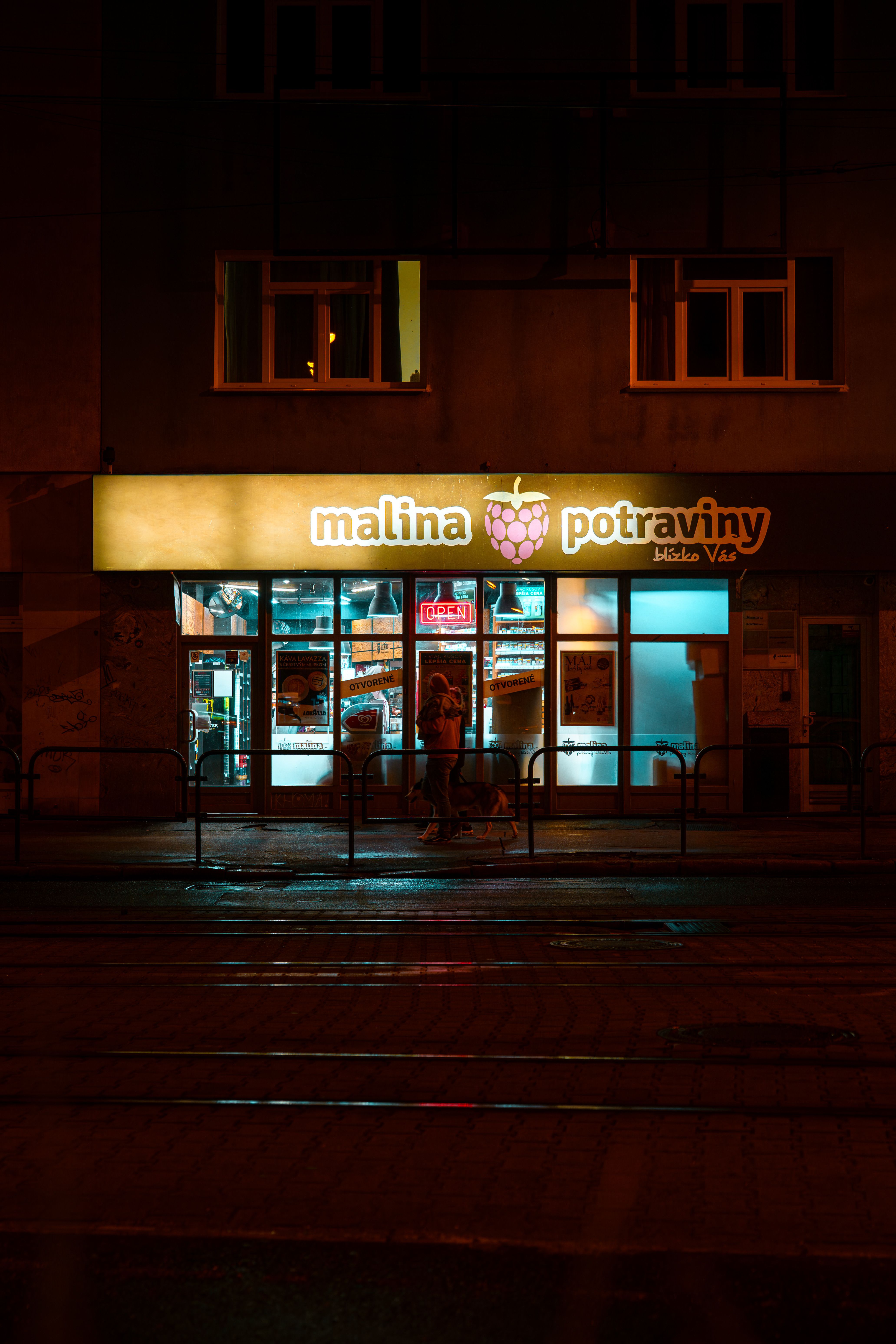 Cozy Nighttime Street Scene at Local Storefront · Free Stock Photo