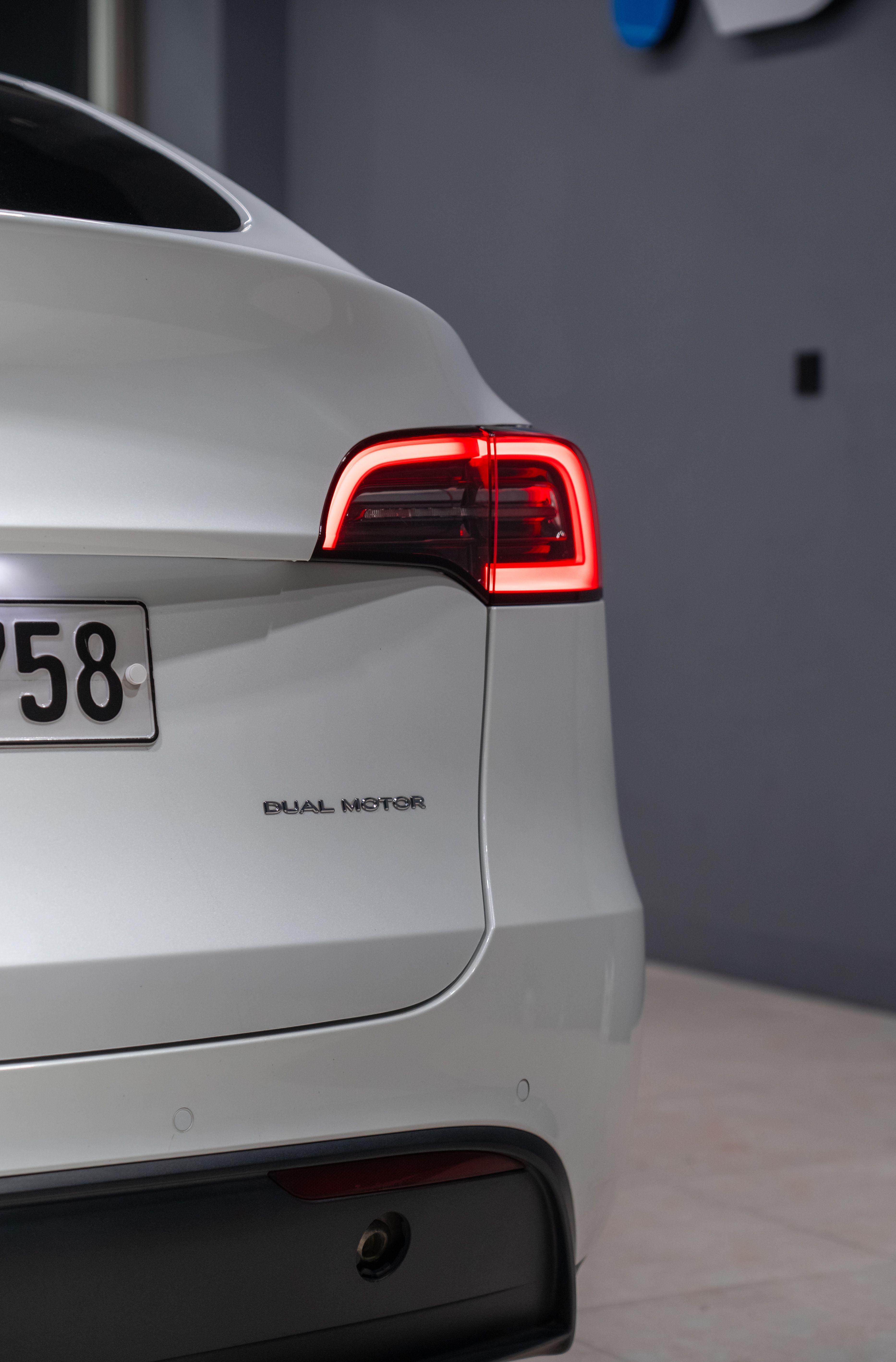 Close-up of a White Electric Car Rear End · Free Stock Photo