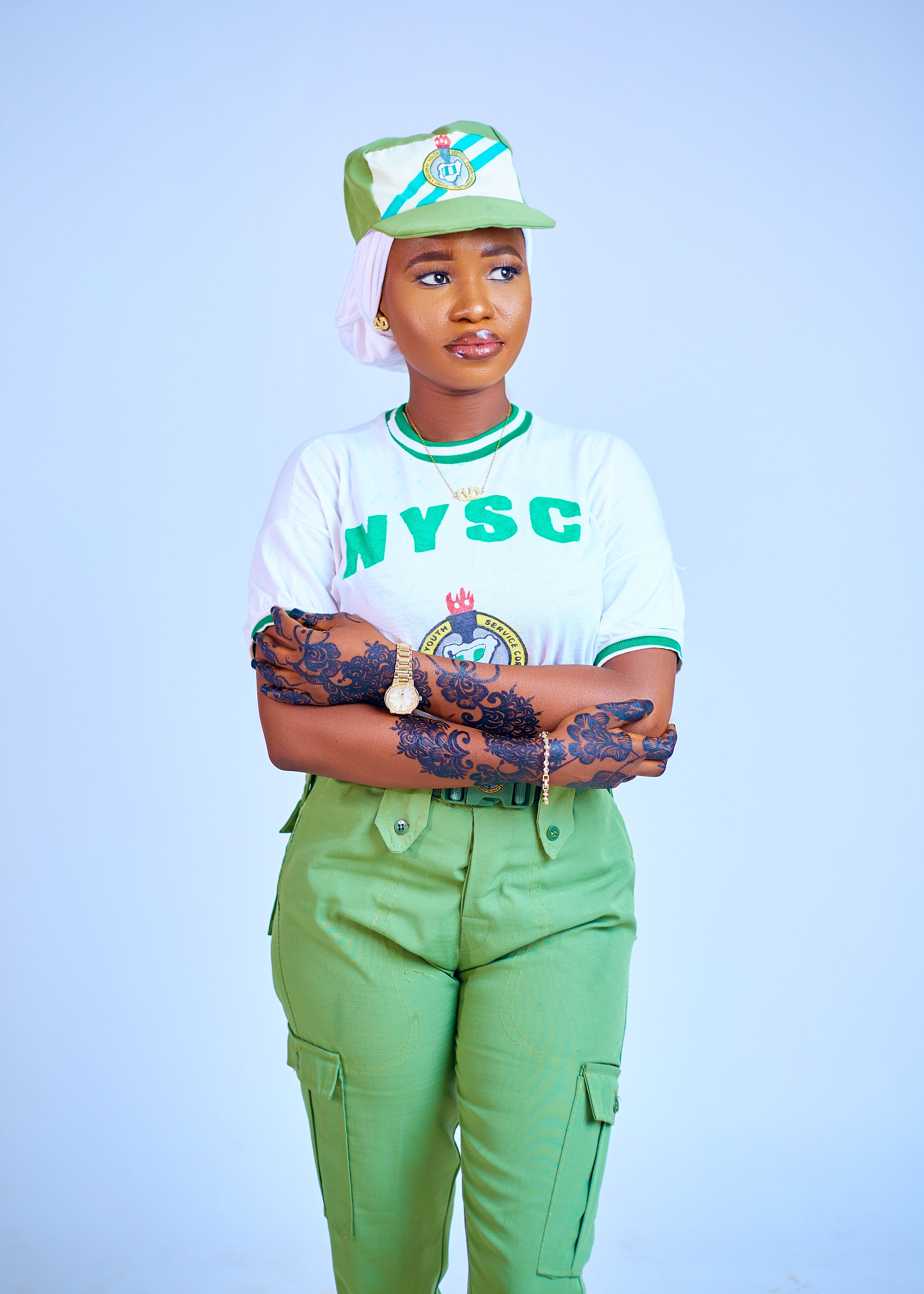 Young Woman in NYSC Uniform with Henna · Free Stock Photo