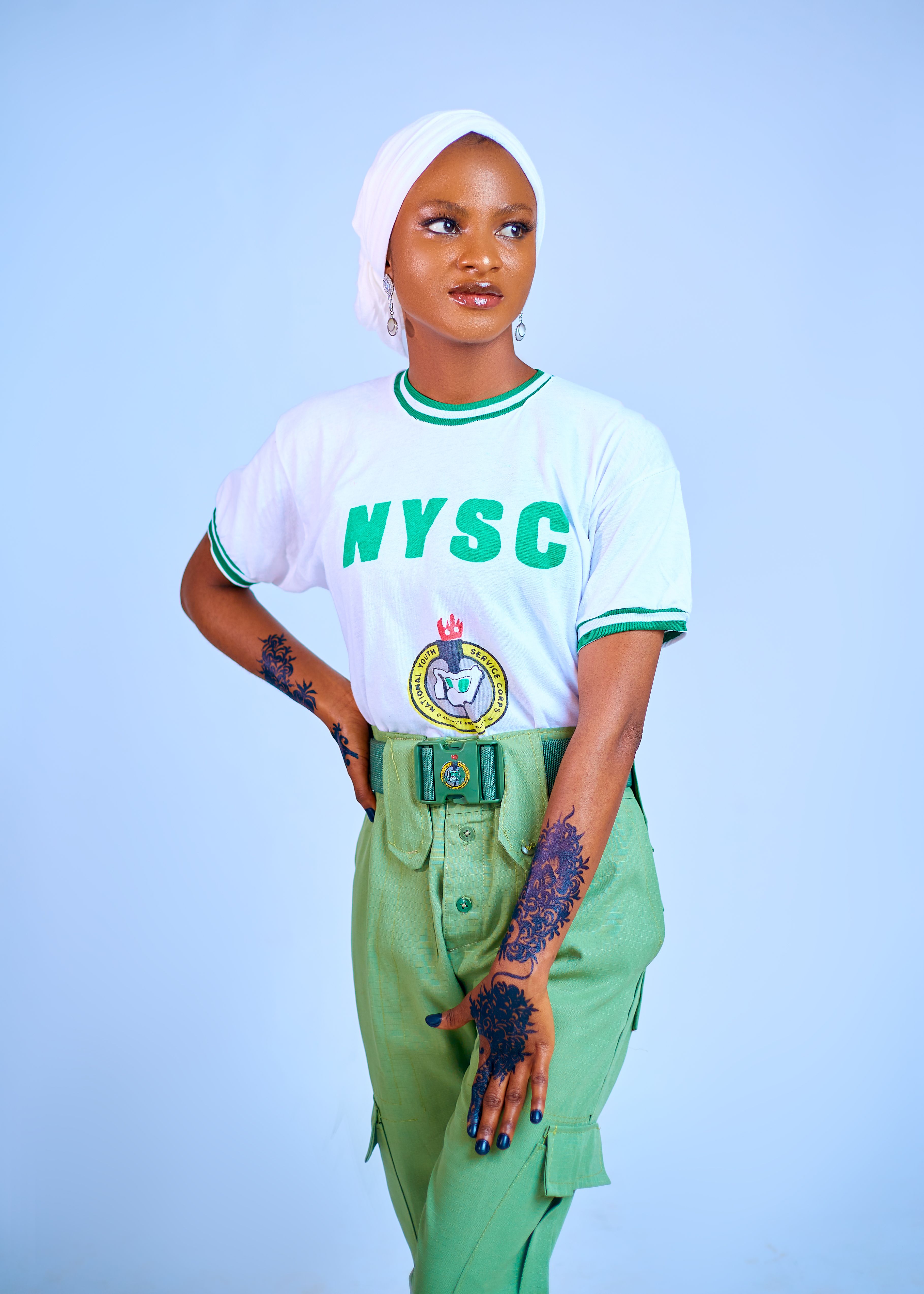 Young Woman in NYSC Uniform with Henna Art · Free Stock Photo