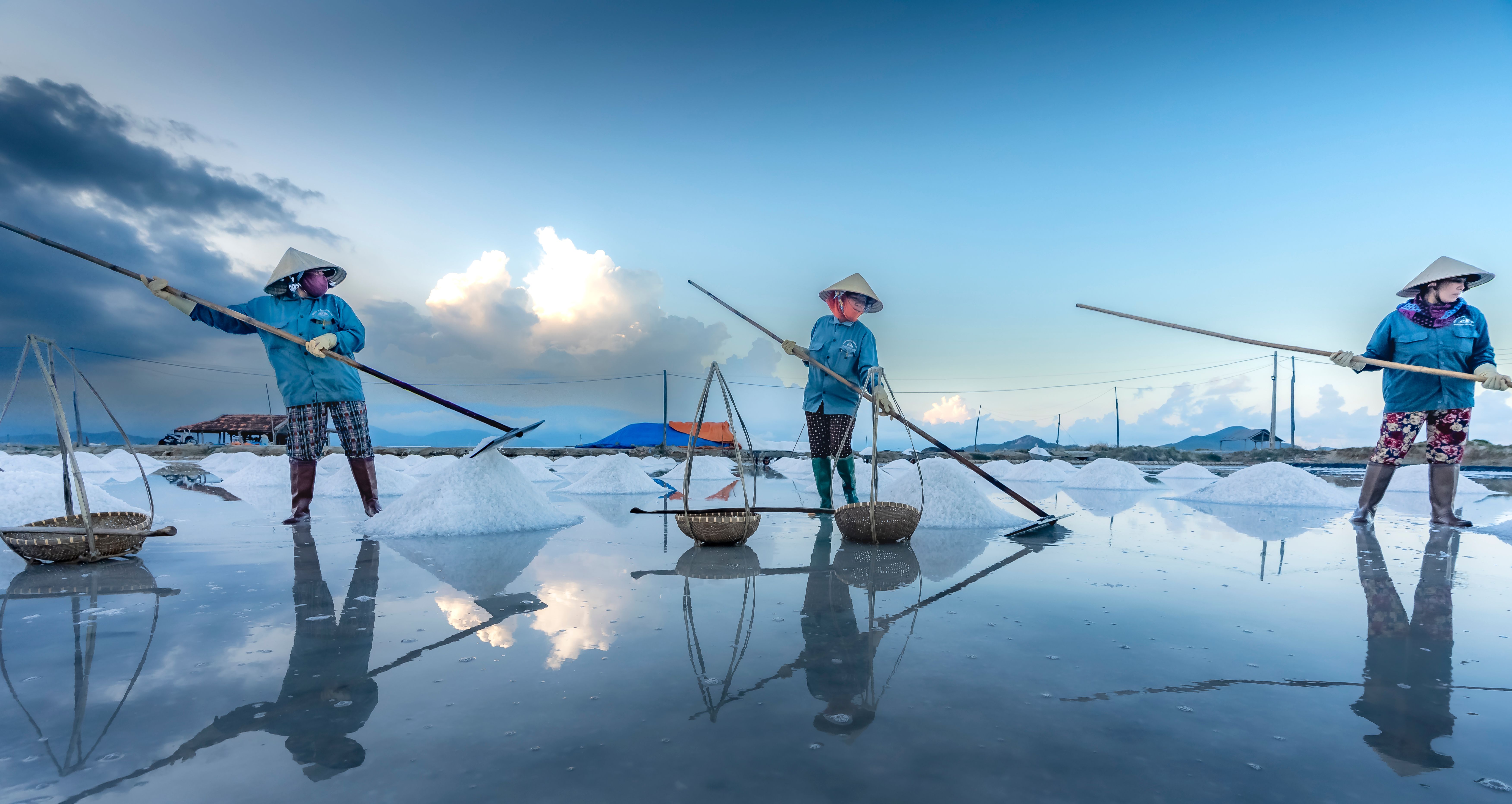 Asian Salt Farmers Working in the Fields · Free Stock Photo