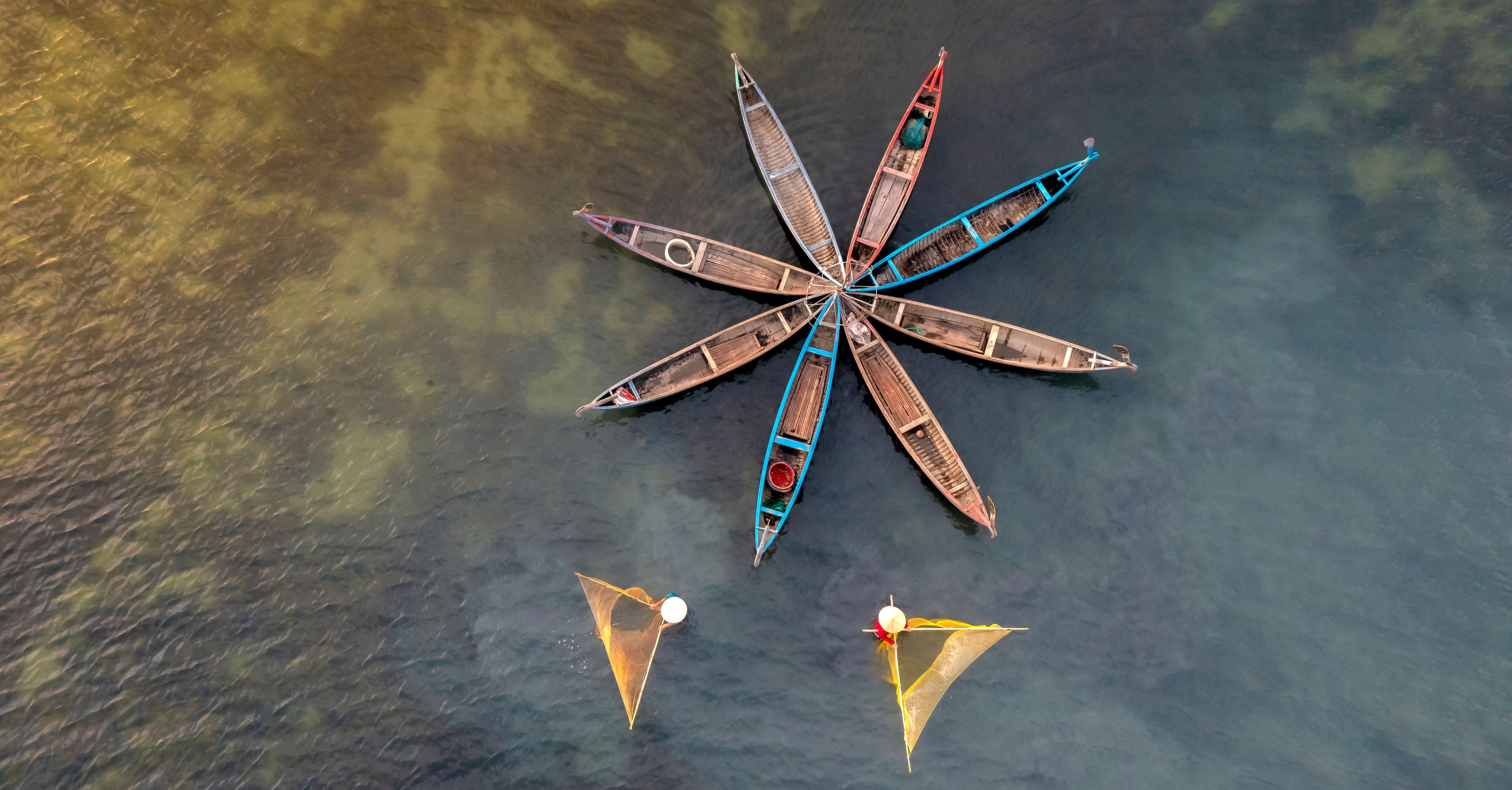 Aerial View of Boat Star Formation on Water · Free Stock Photo