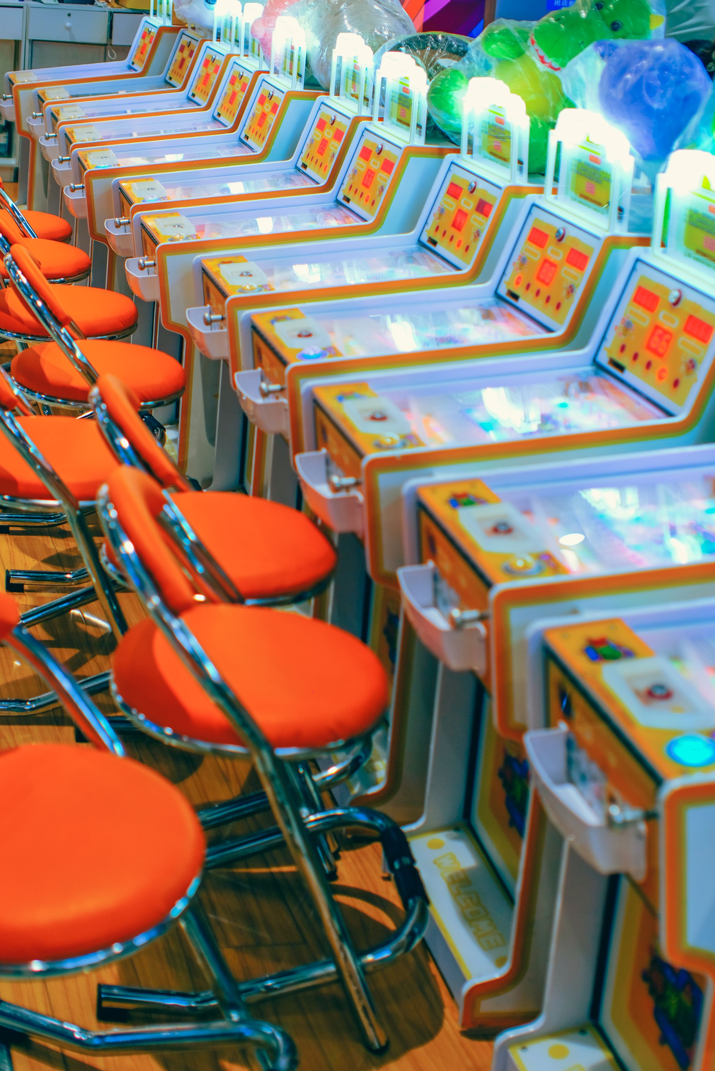Colorful Arcade Gaming Machines in a Row · Free Stock Photo