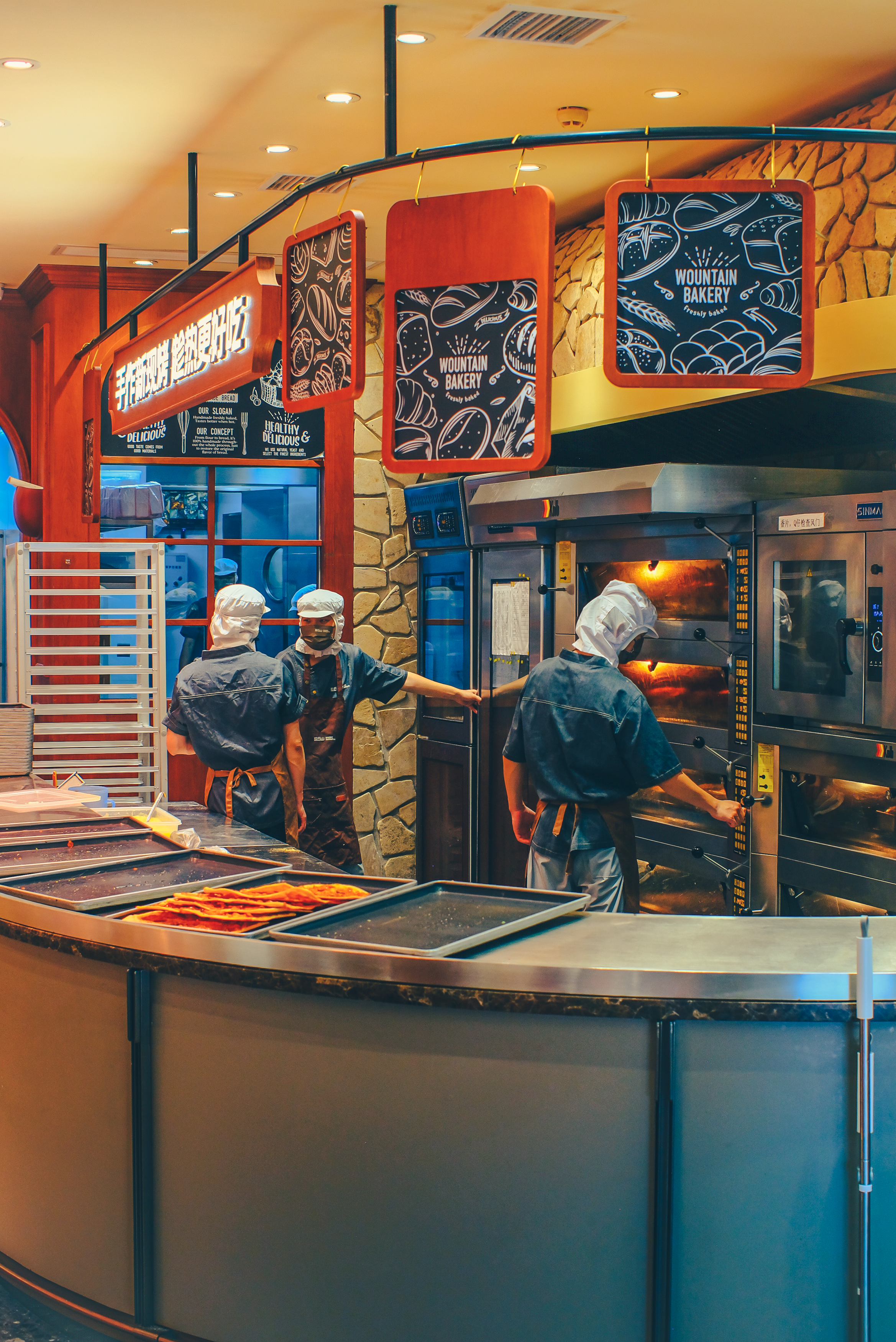 Professional Bakers Working in a Modern Bakery · Free Stock Photo