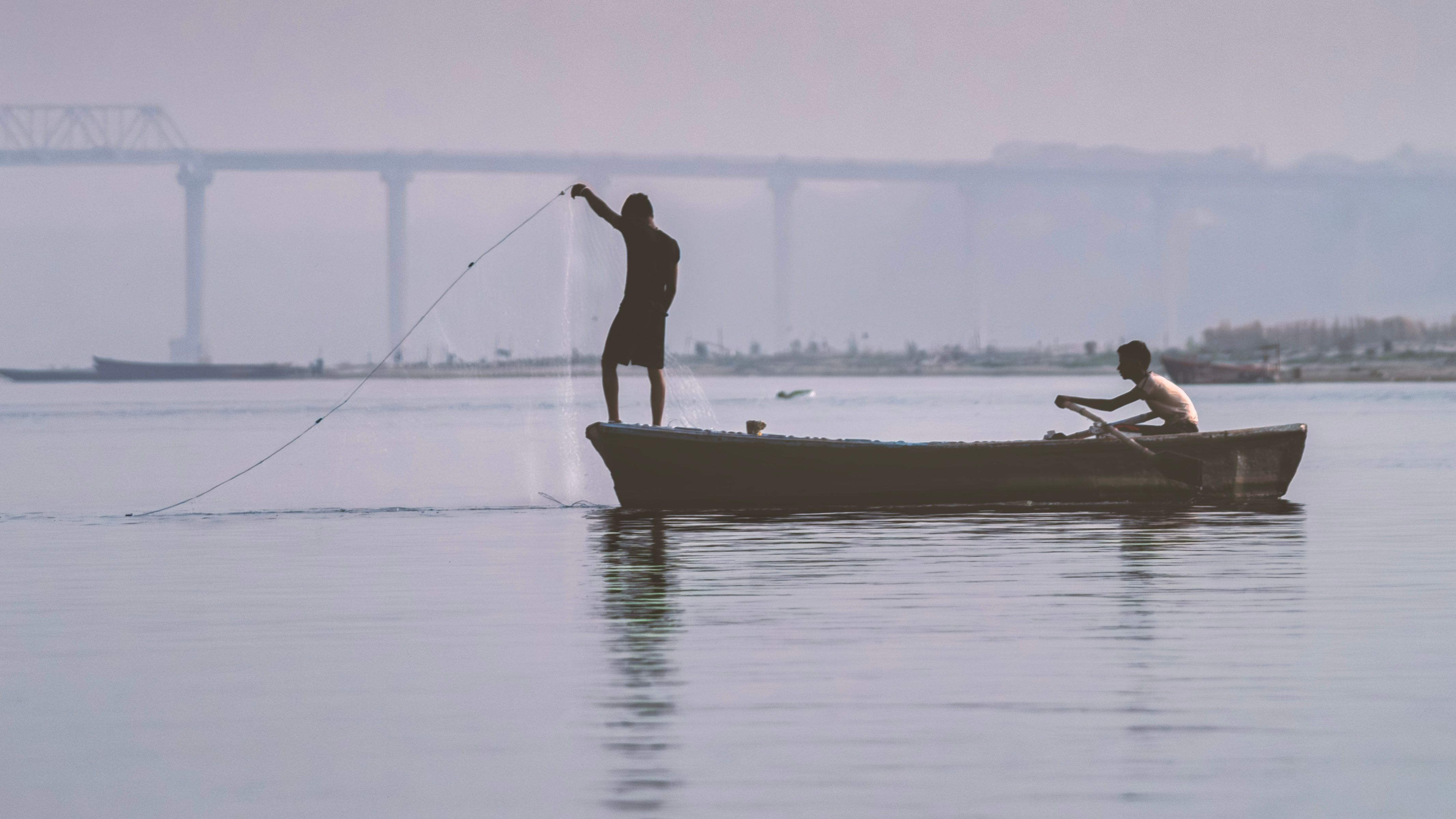 Traditional Fishing Scene on Ganges River in India · Free Stock Photo