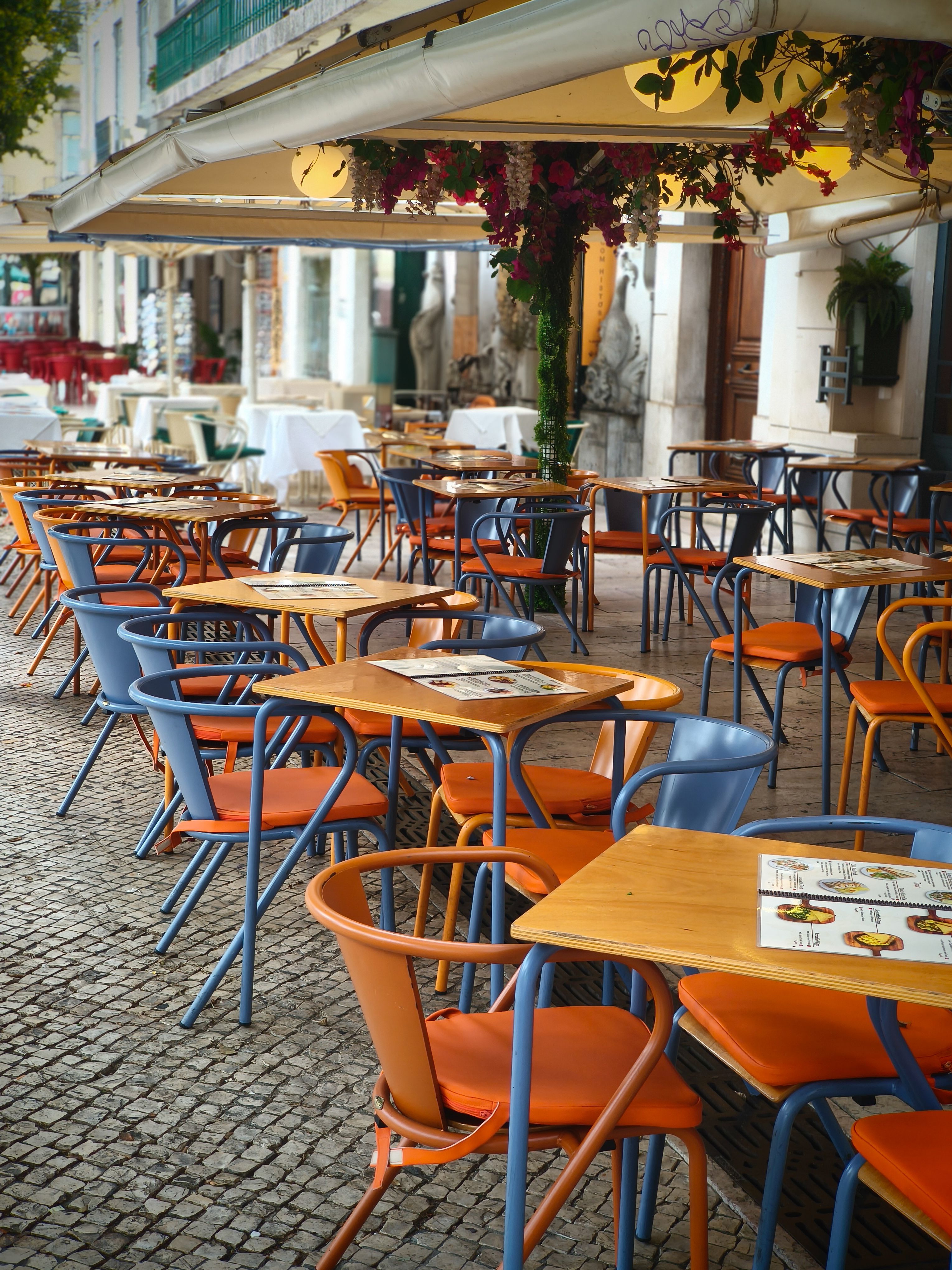 Outdoor Café Seating in a Lisbon Street · Free Stock Photo