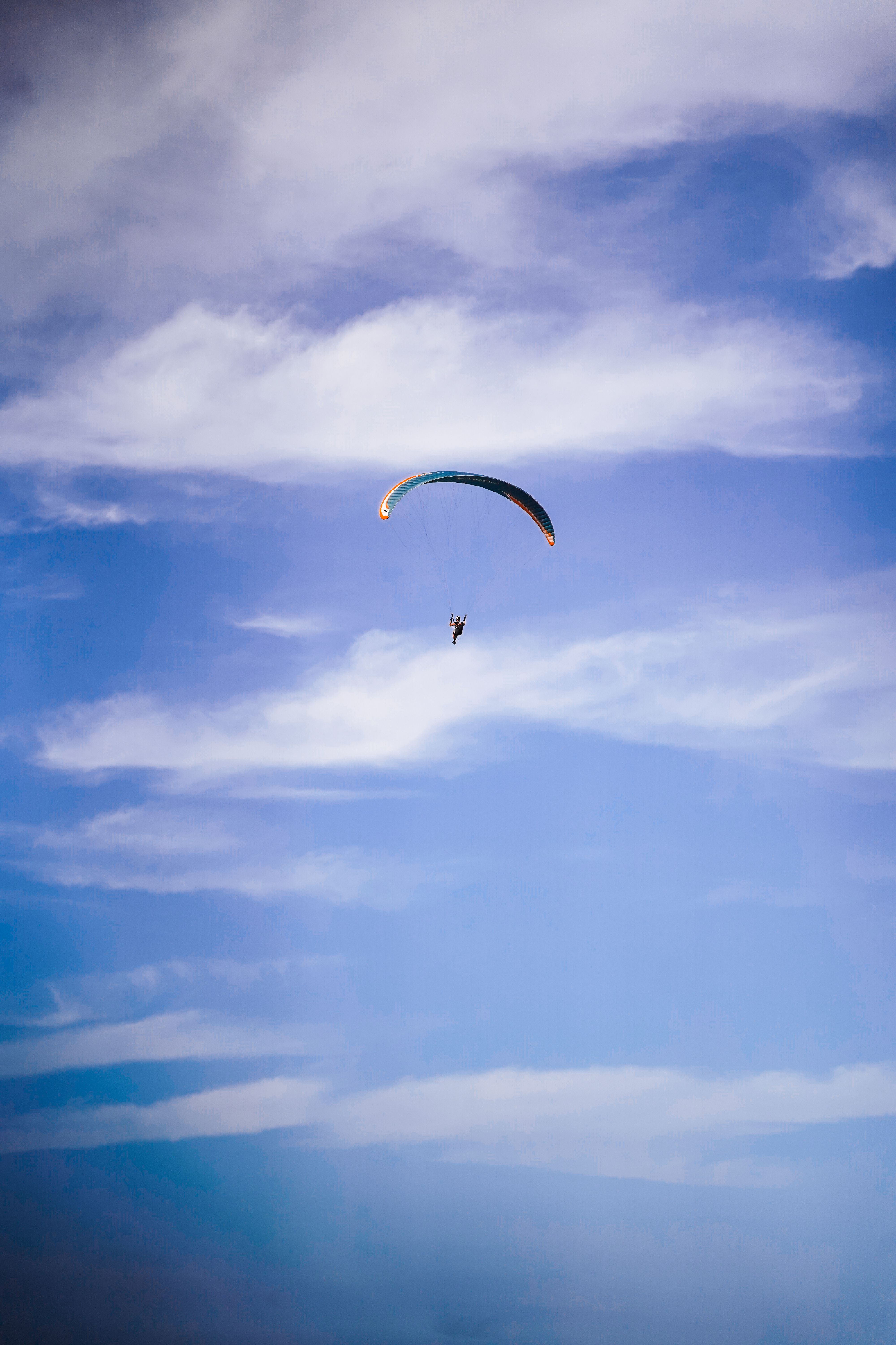 Paraglider Soaring in the Clear Blue Sky · Free Stock Photo