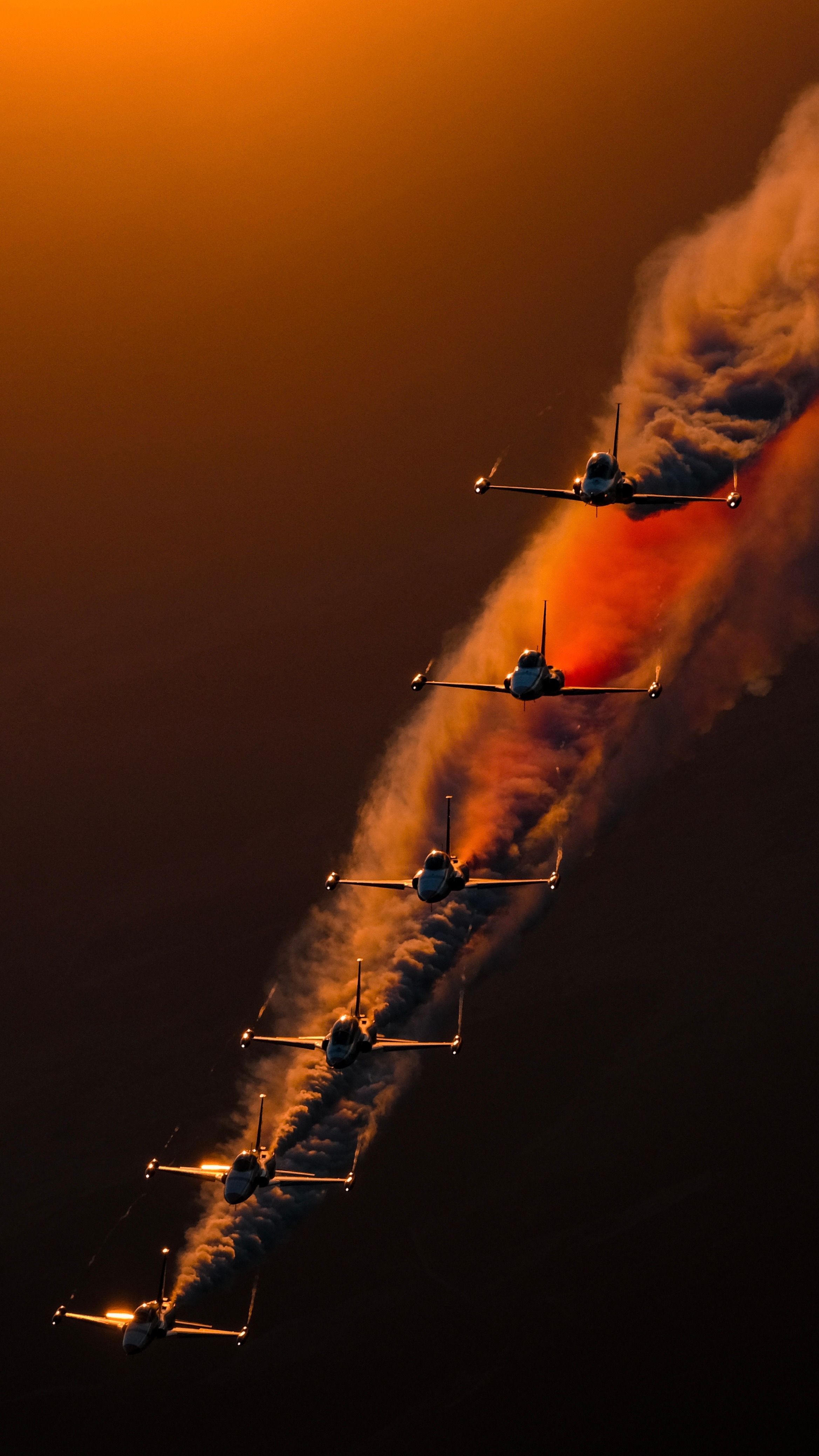 Formation Flight of Aerobatic Jets at Sunset · Free Stock Photo