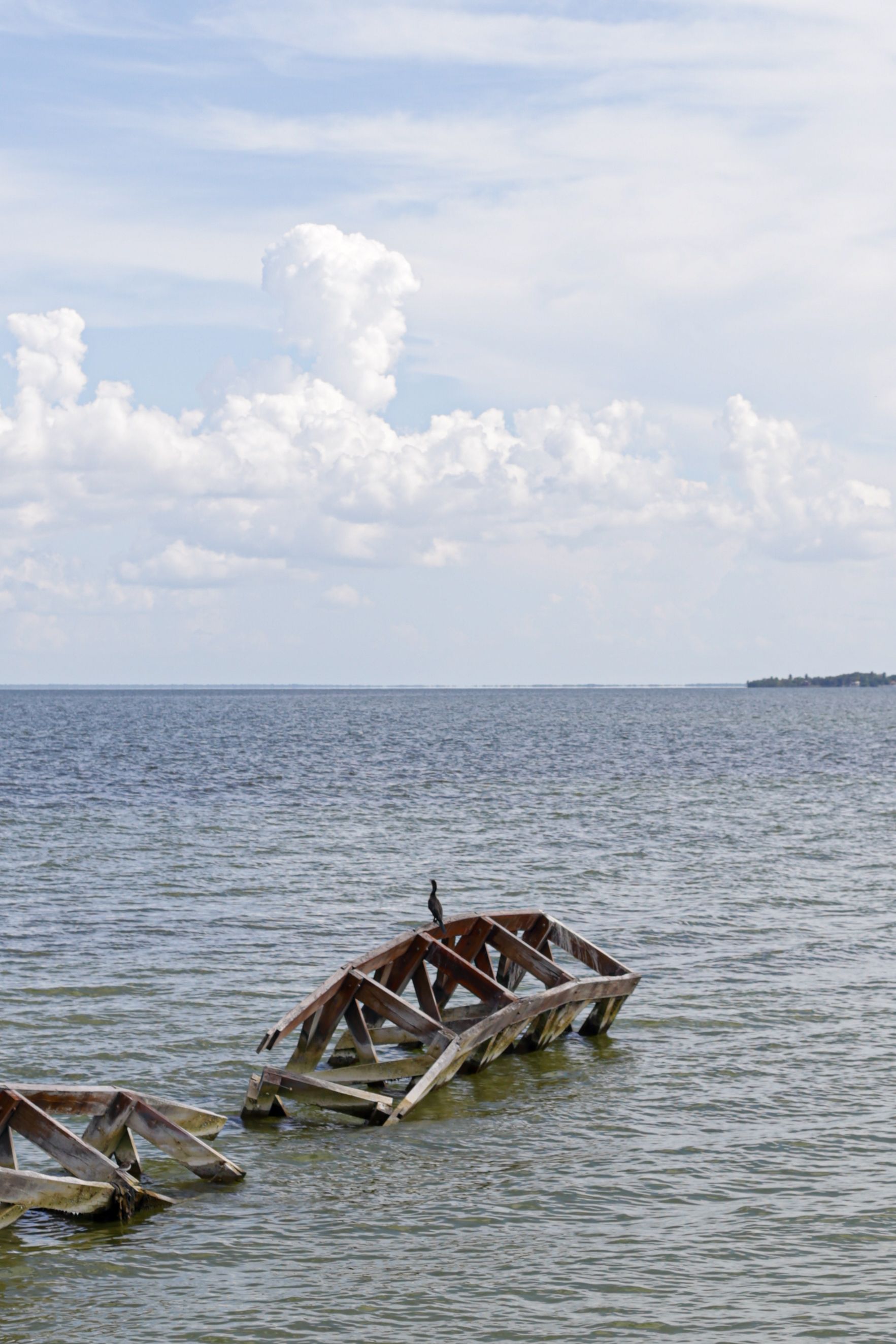 Rustic Wooden Structures in Tranquil Lake · Free Stock Photo