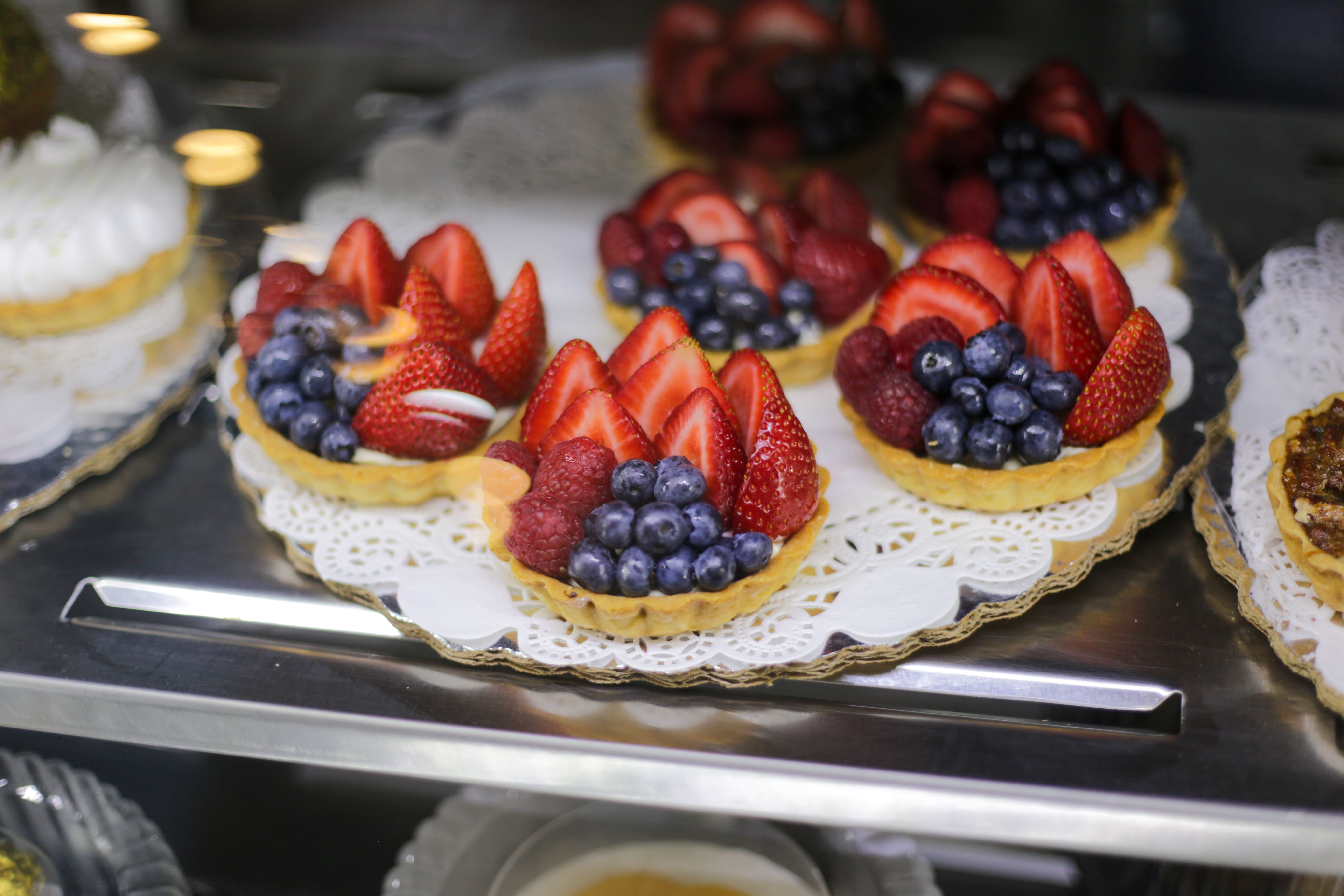 Delicious Fruit Tarts with Fresh Berries on Display · Free Stock Photo