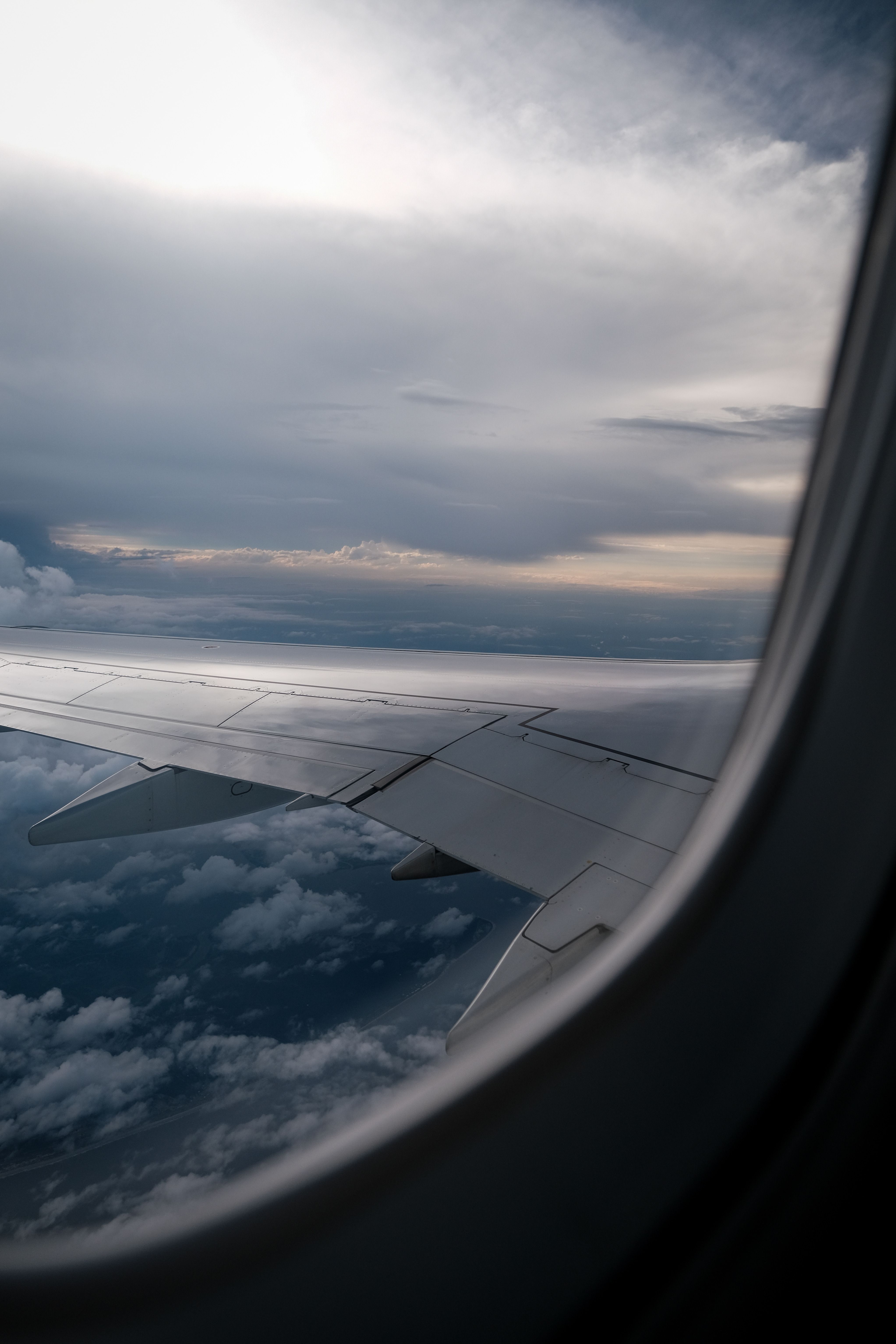 Scenic Airplane Wing View Above Clouds · Free Stock Photo