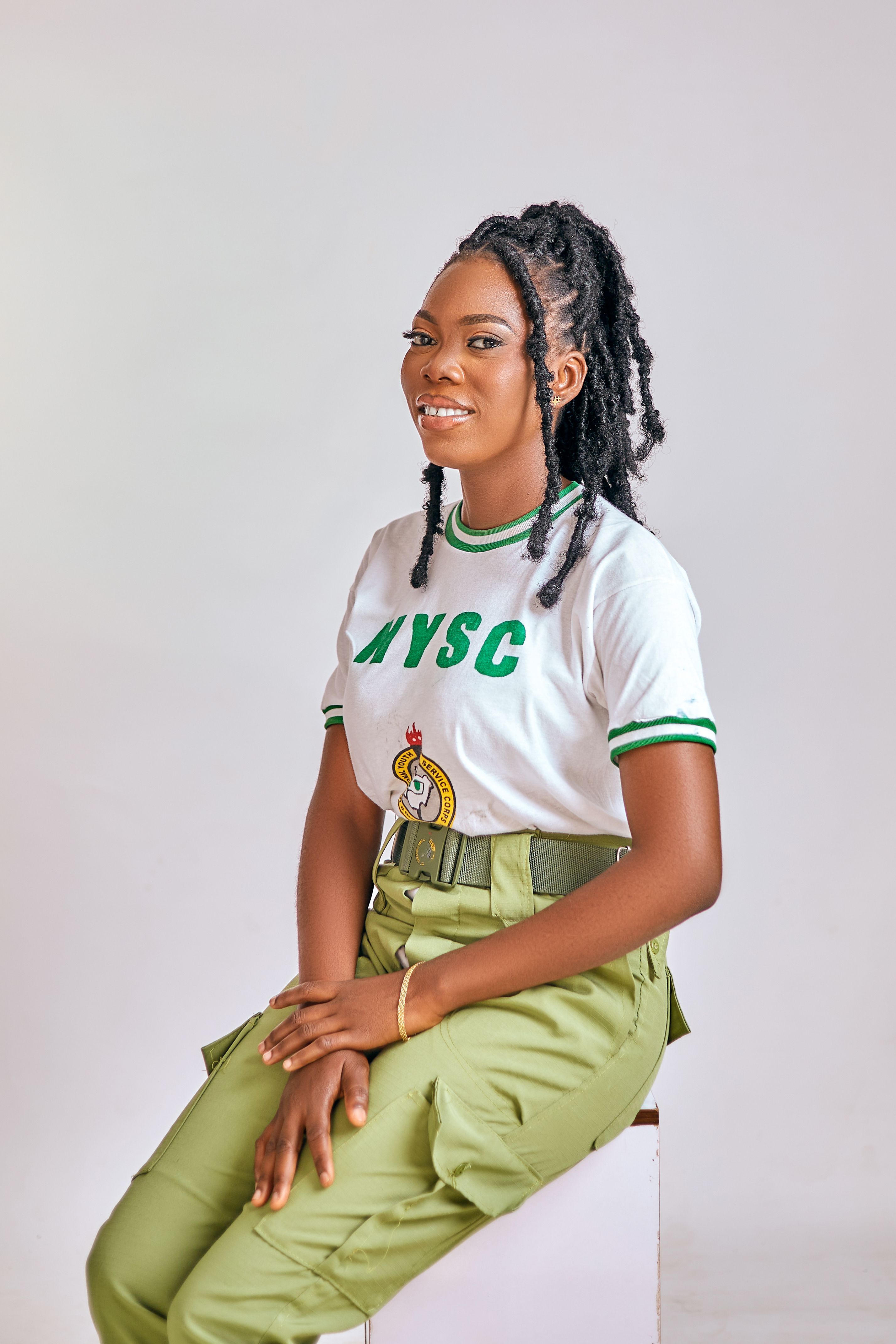 Young Woman in NYSC Uniform Smiling · Free Stock Photo