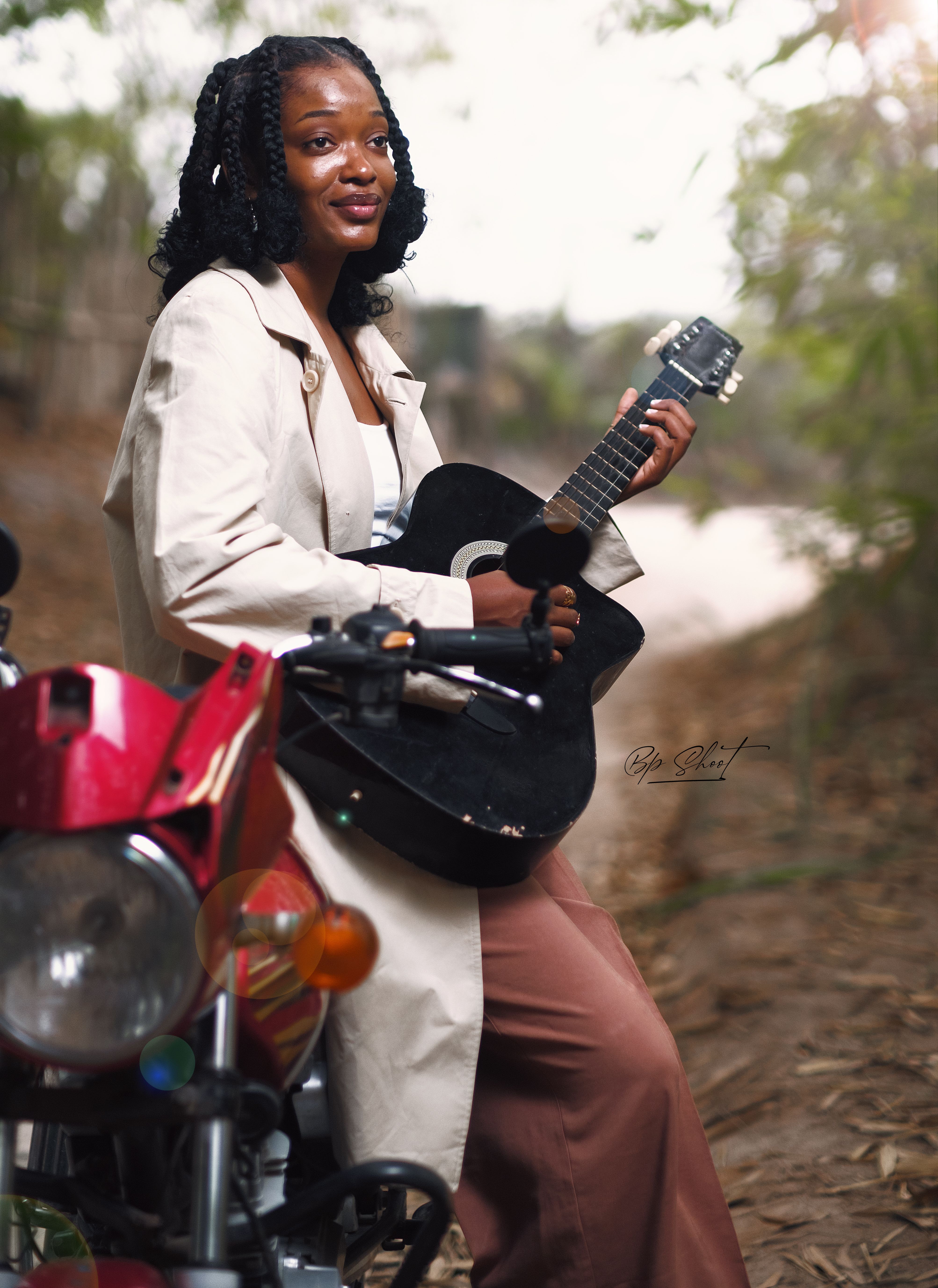 Woman Playing Guitar Beside Motorcycle in Nature · Free Stock Photo