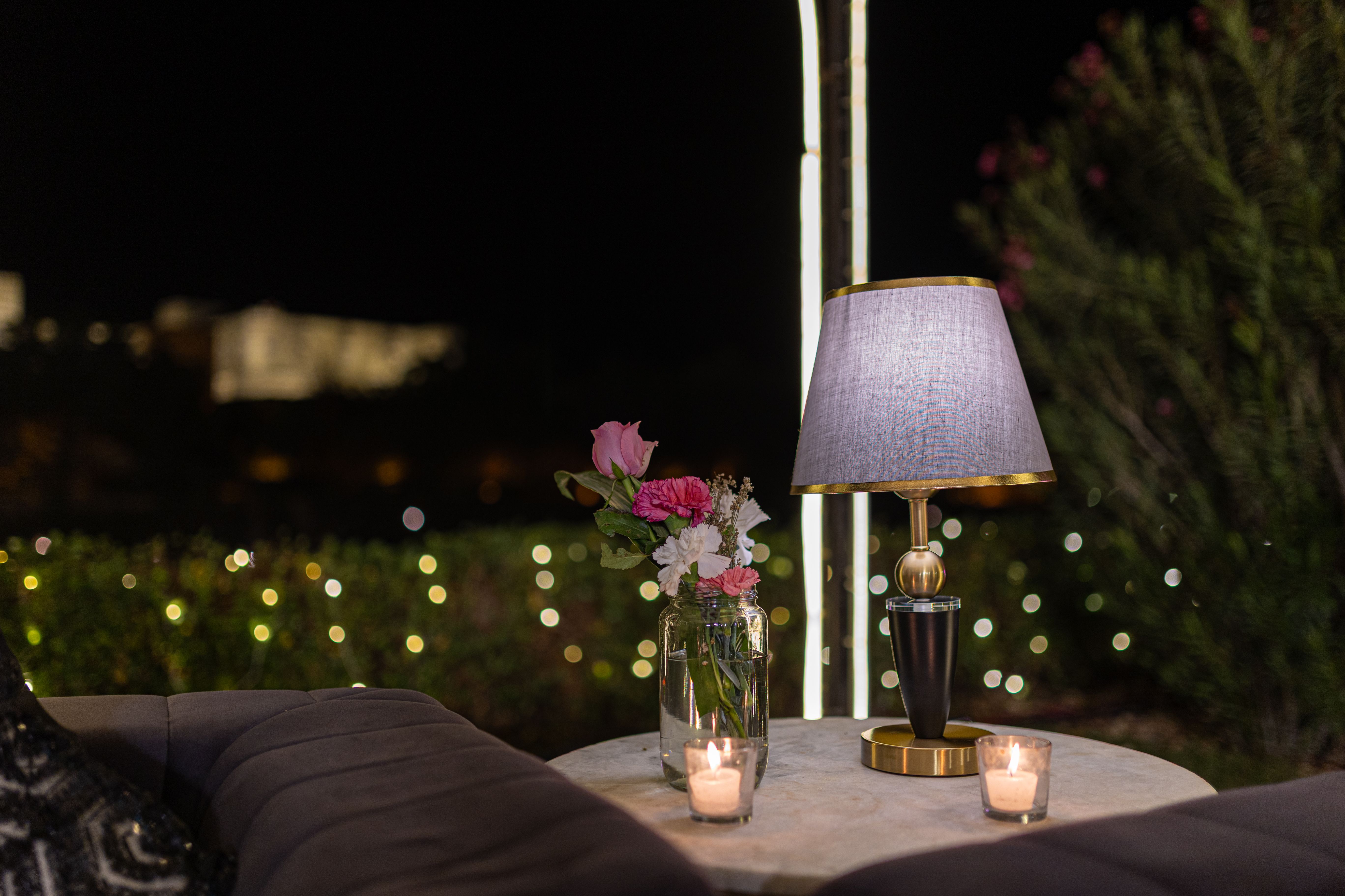 Cozy Outdoor Evening with Flowers and Lamp · Free Stock Photo