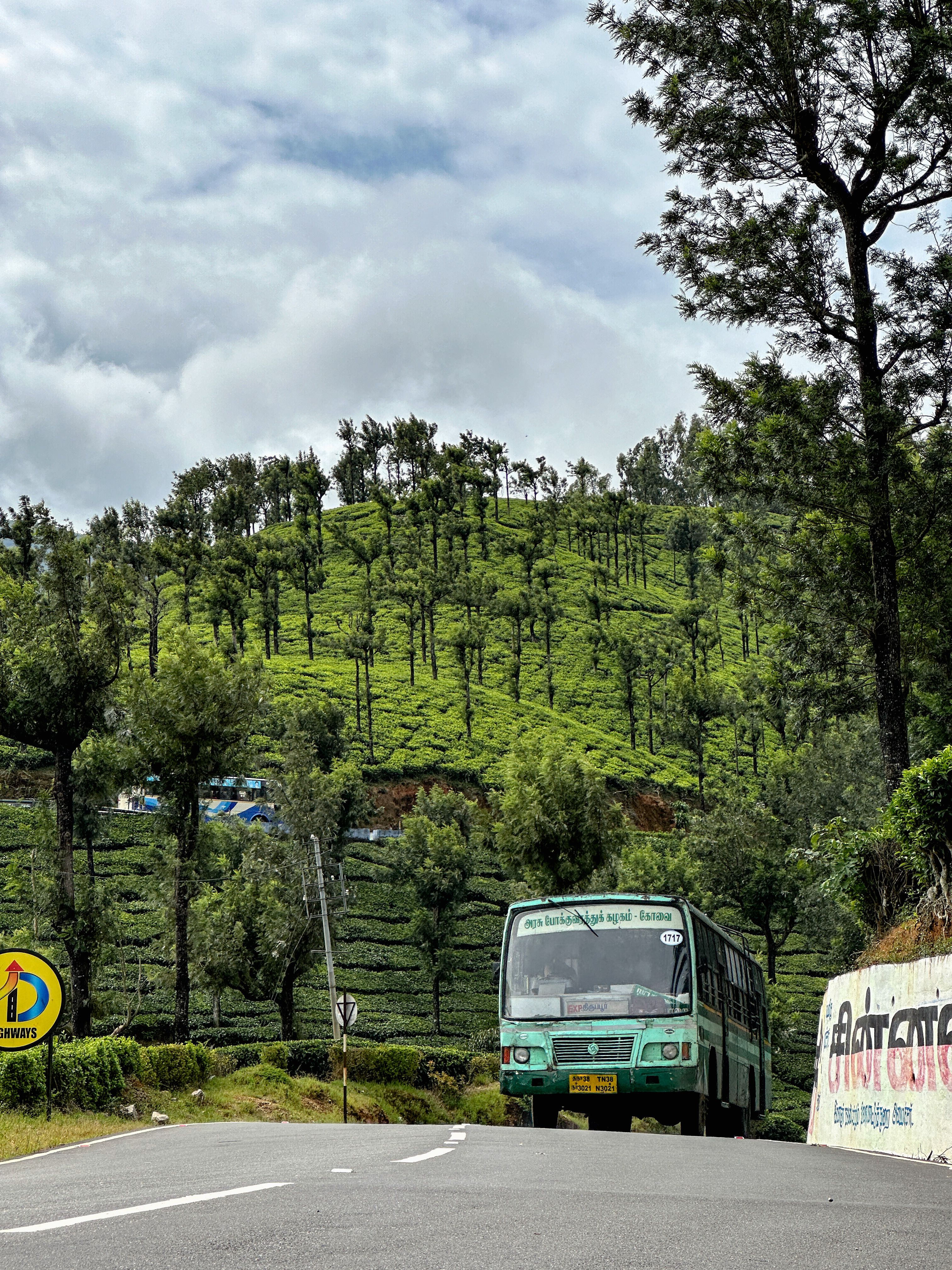 Scenic Bus Ride Through Lush Green Hillside · Free Stock Photo