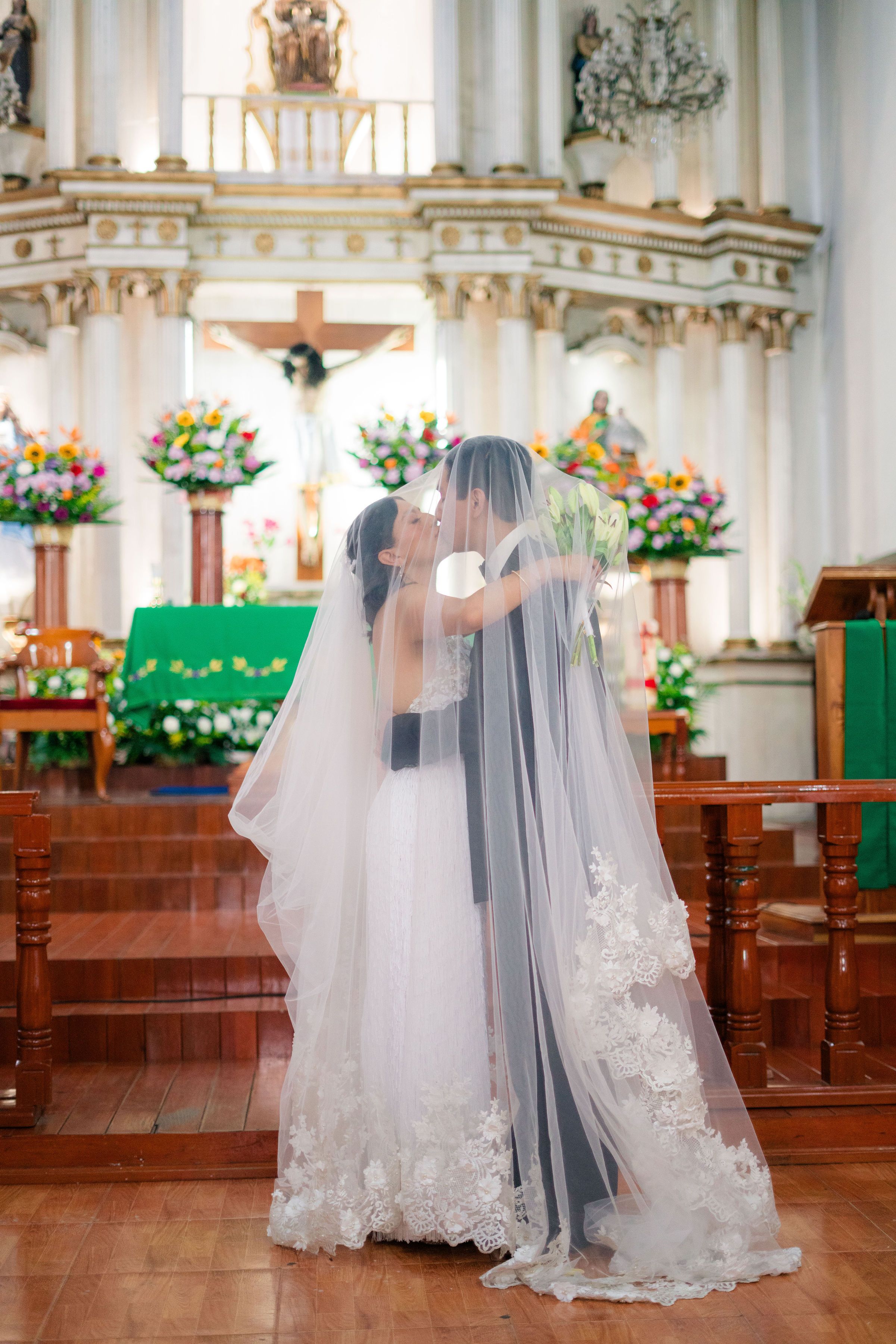 Romantic Couple in a Church Wedding Setting · Free Stock Photo