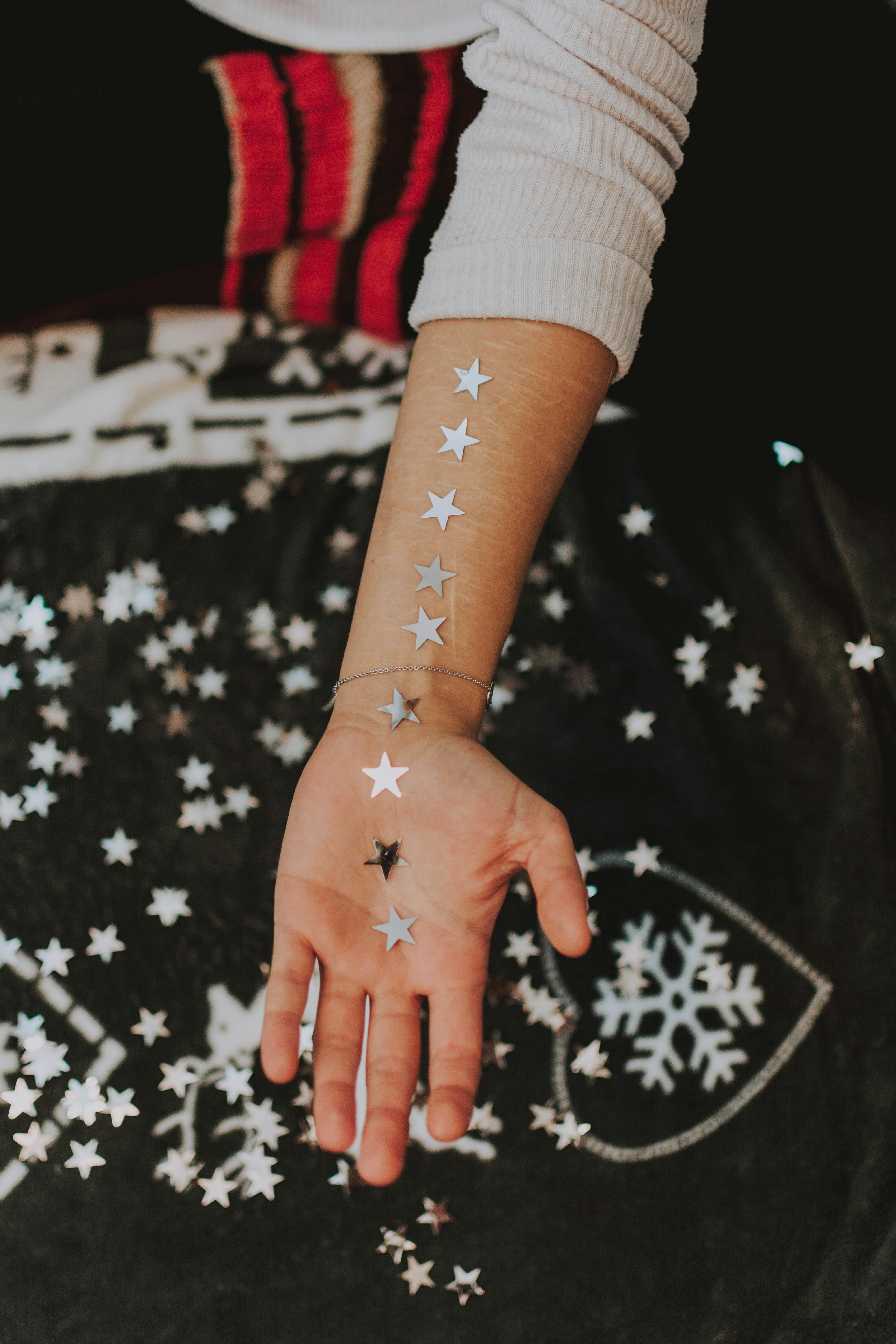 Photo Of Person Hand's With Stars · Free Stock Photo