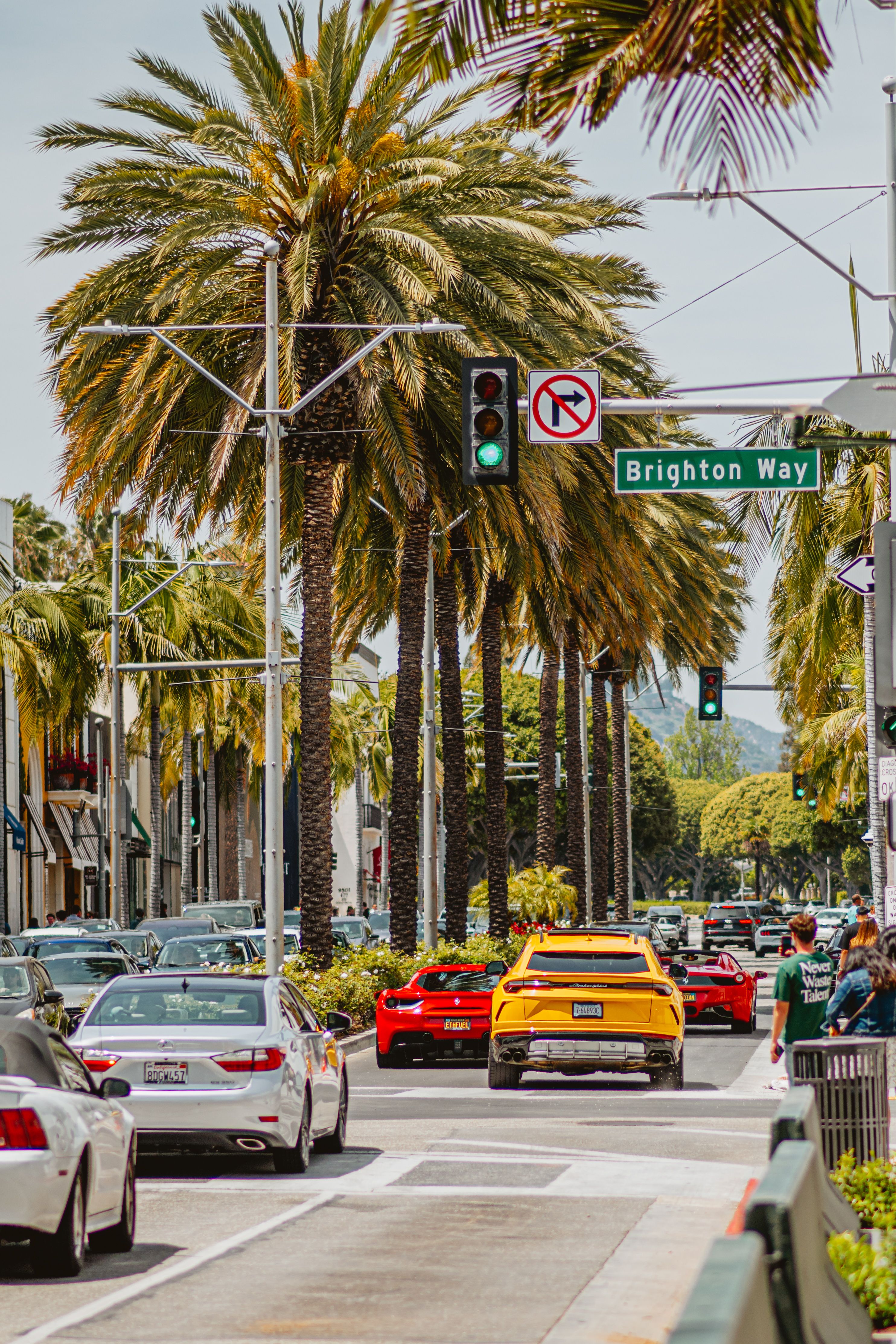 Vibrant Rodeo Drive with Exotic Cars and Palms · Free Stock Photo