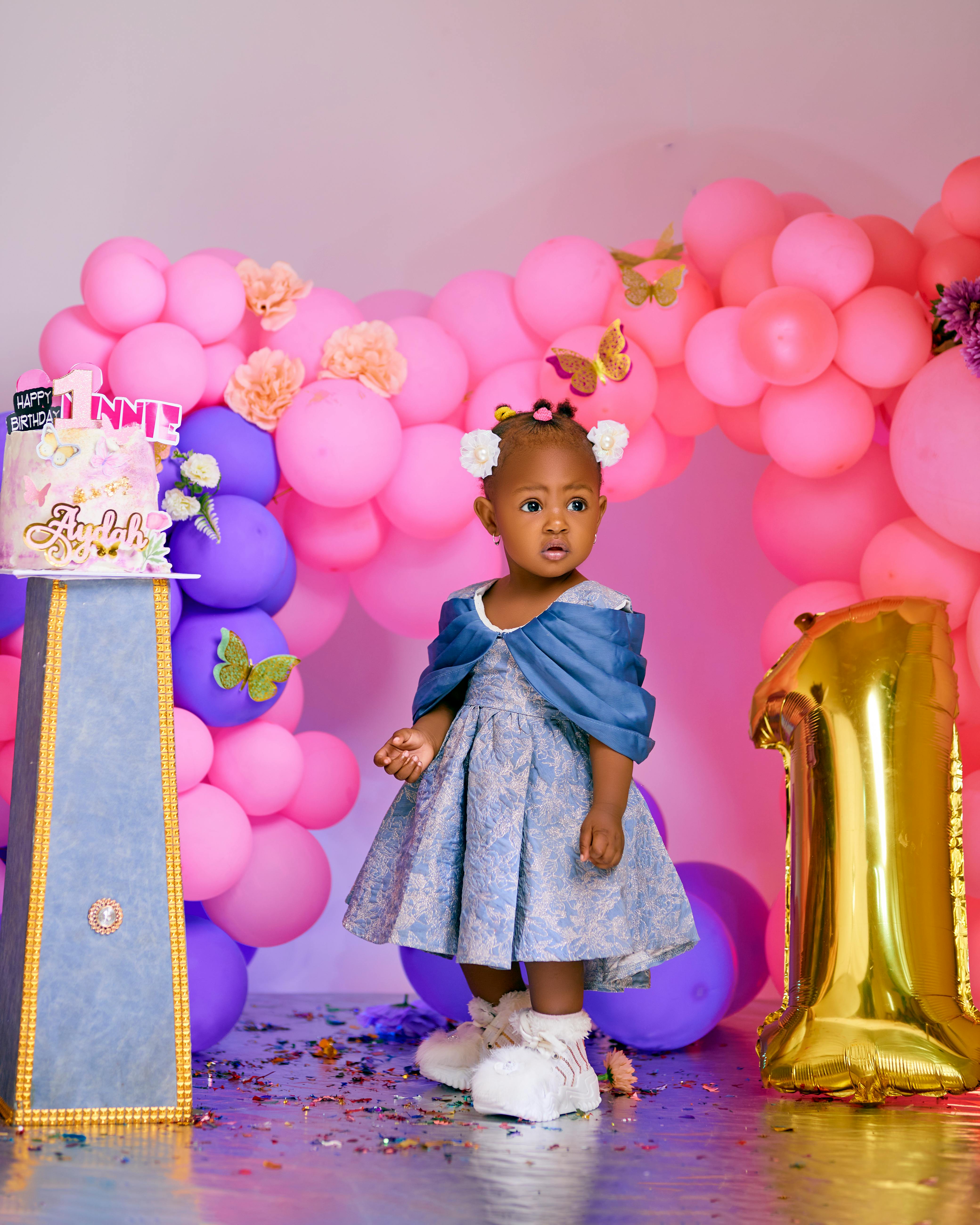 Joyful Toddler's Birthday Party with Pink Balloons · Free Stock Photo