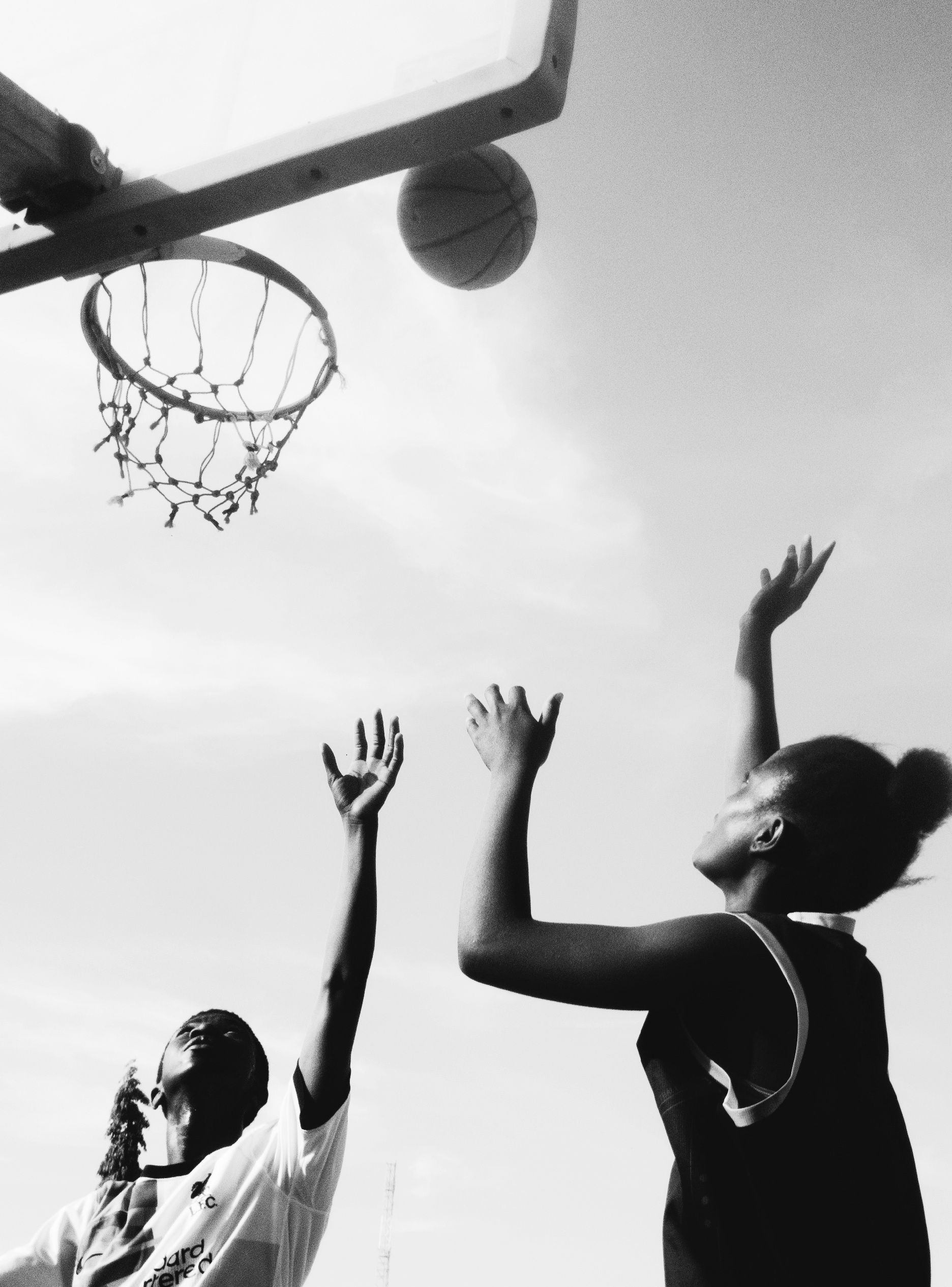 Dynamic Black and White Outdoor Basketball Game · Free Stock Photo