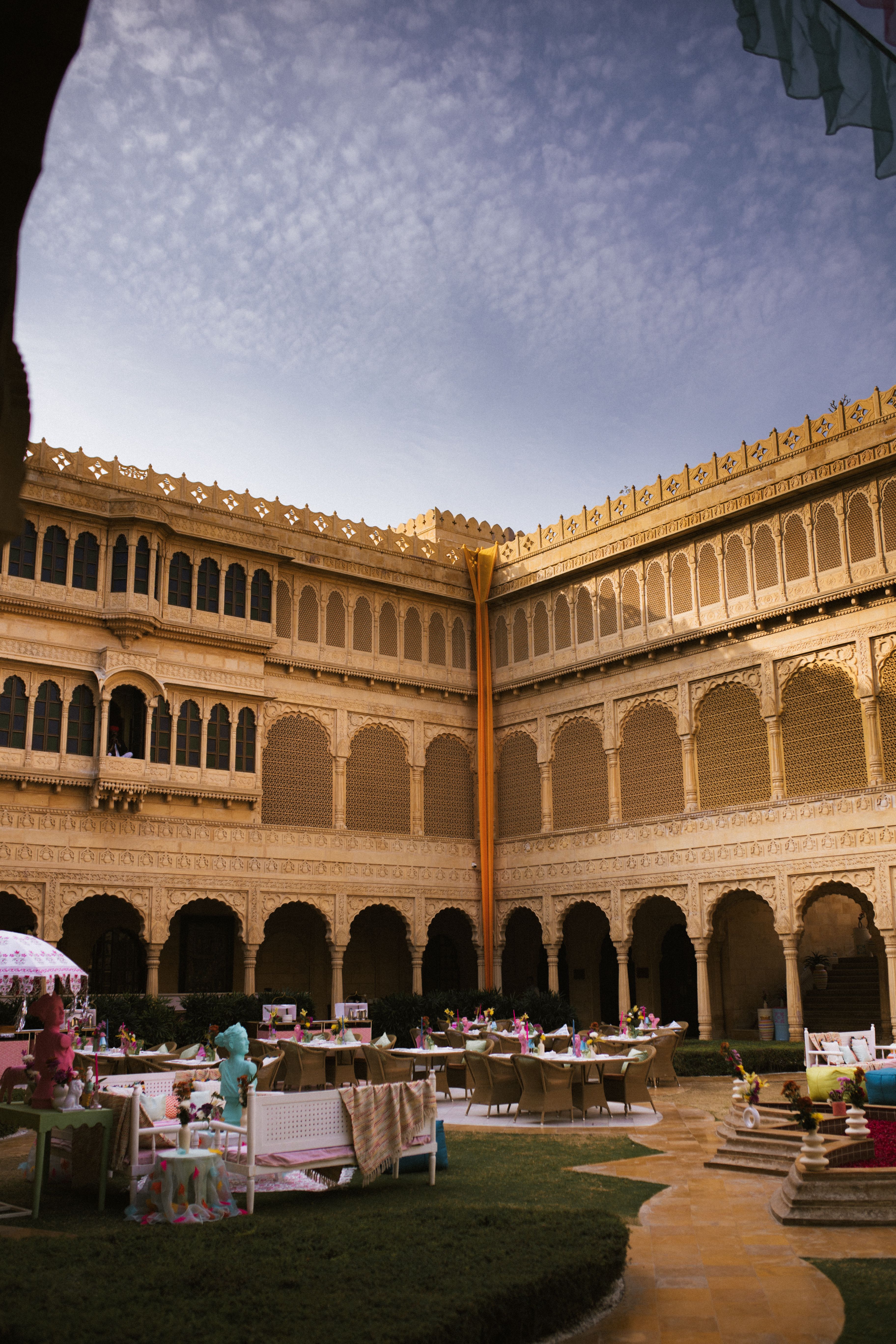 Elegant Courtyard Gathering in Historical Setting · Free Stock Photo