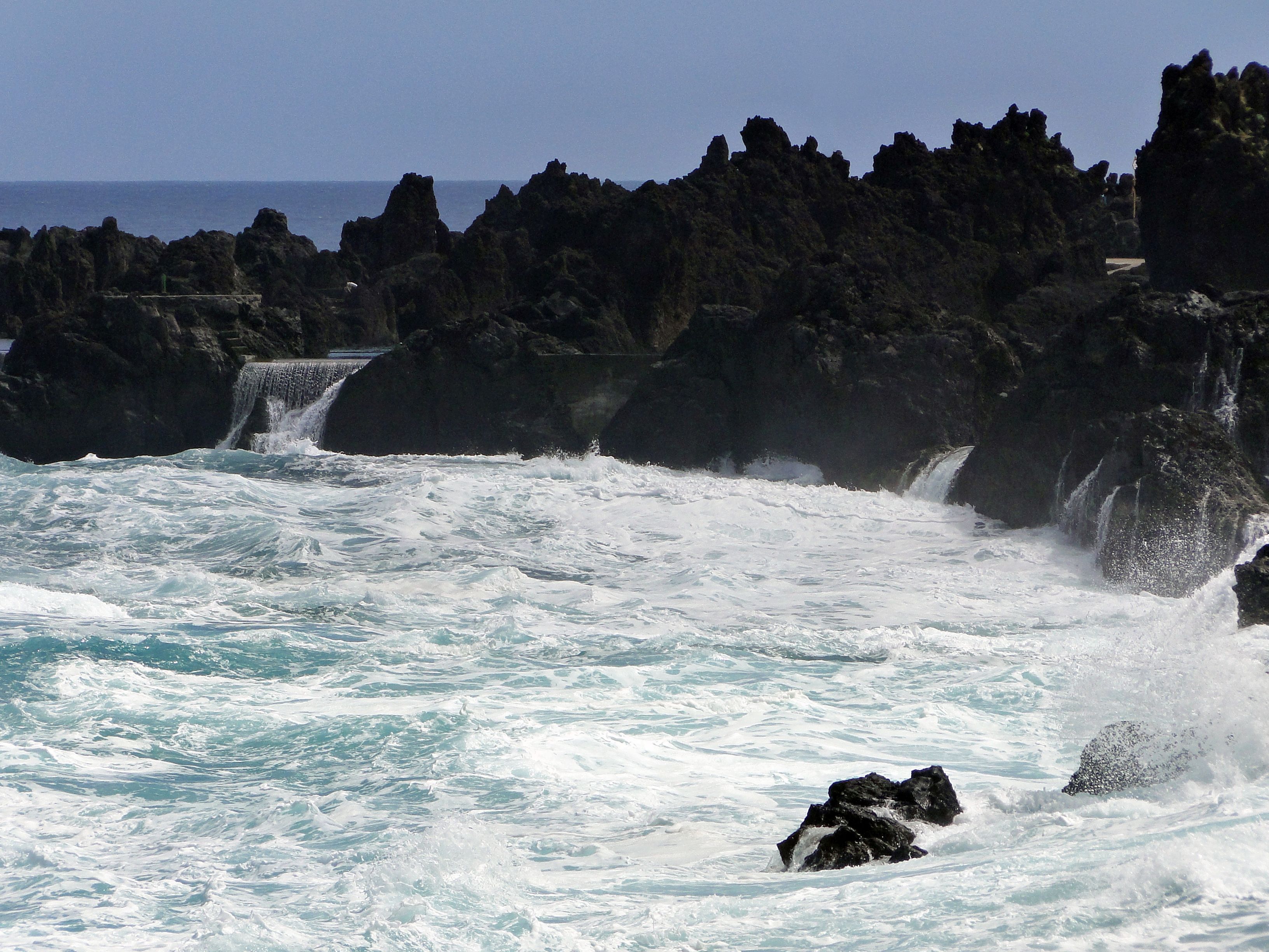 Dramatic Waves Crashing on Volcanic Cliffs in Madeira · Free Stock Photo