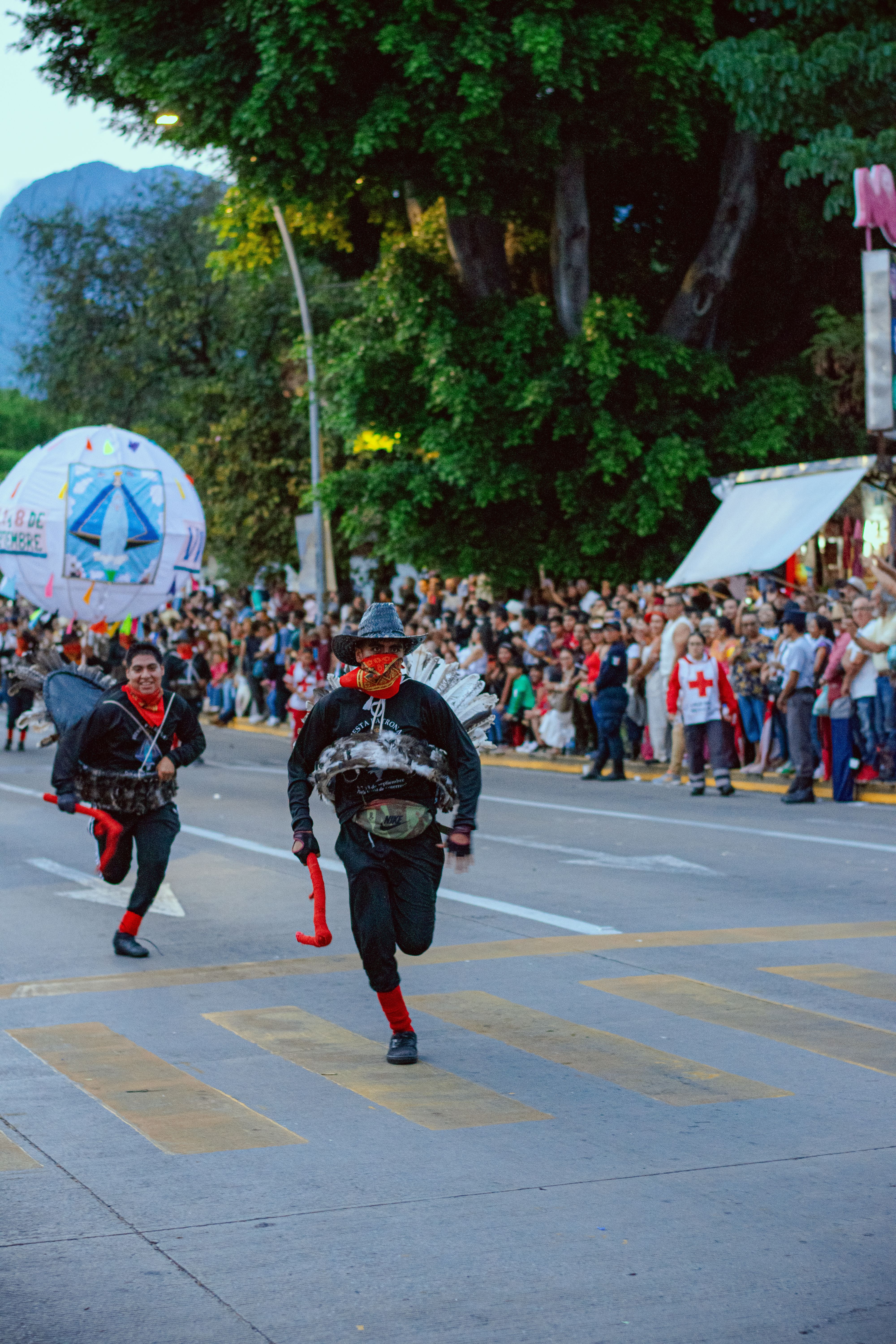 Colorful Street Parade with Costumed Performers · Free Stock Photo