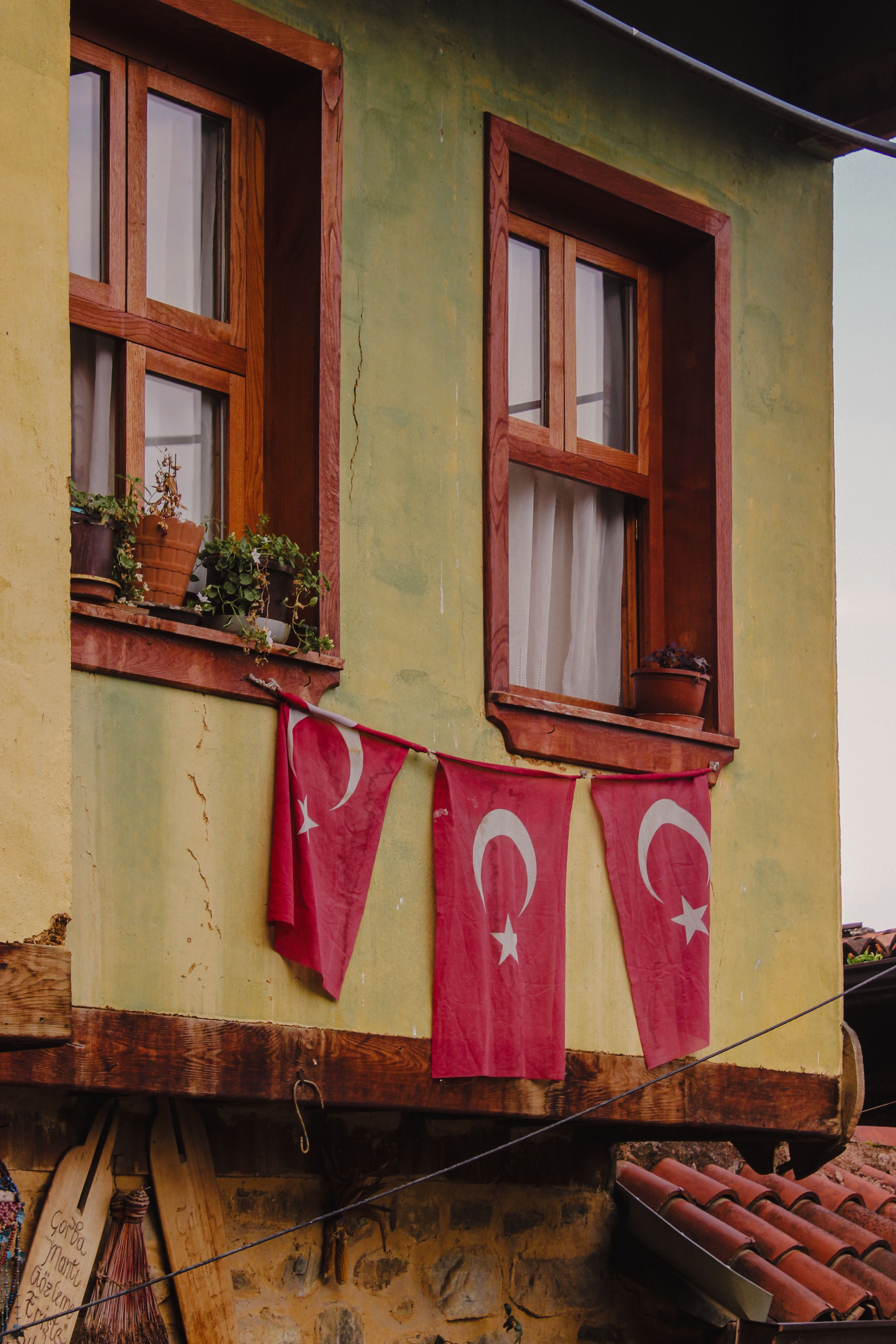Traditional Turkish Home with Flags Displayed · Free Stock Photo
