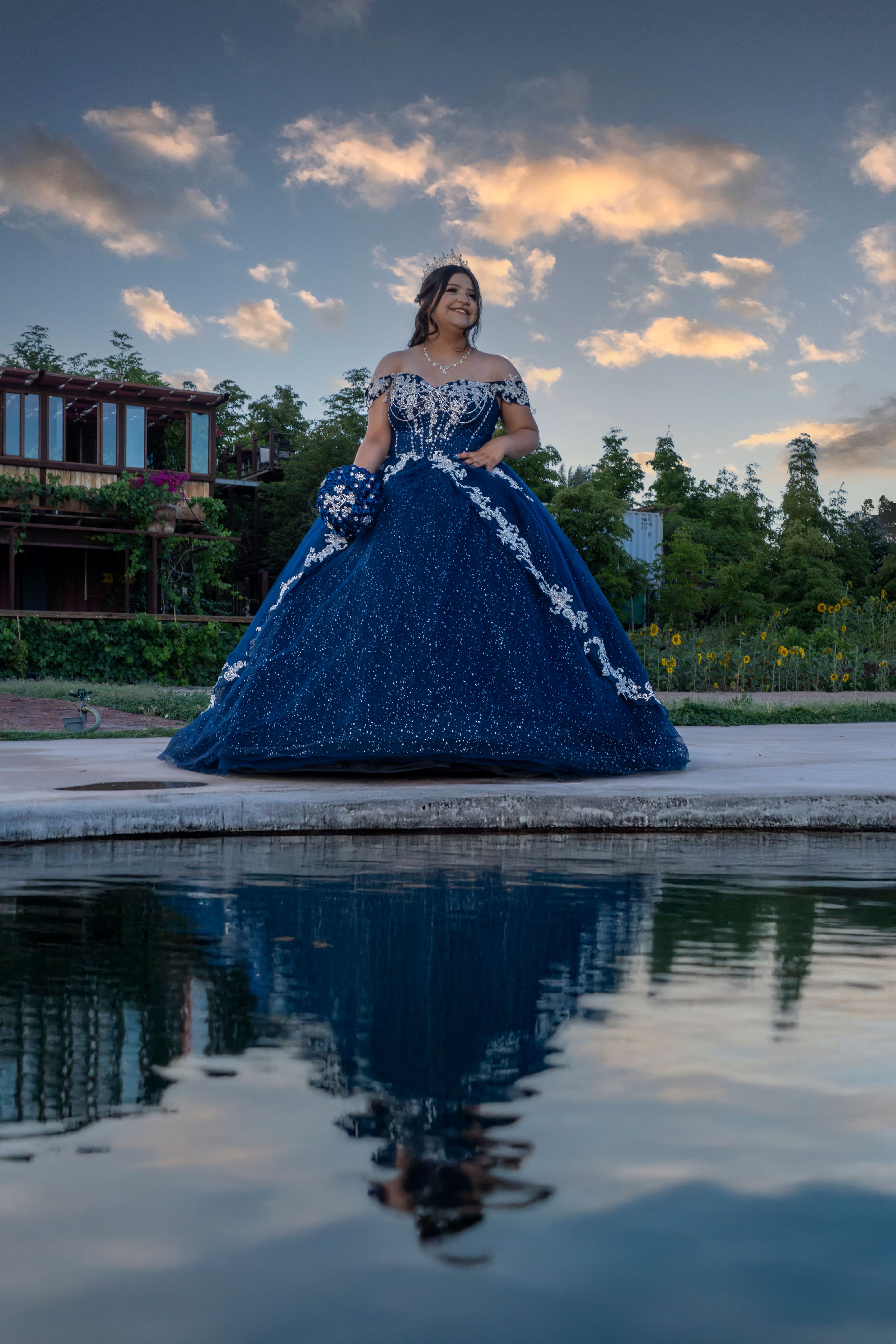 Elegant Quinceañera in Blue Dress by Reflection Pool · Free Stock Photo