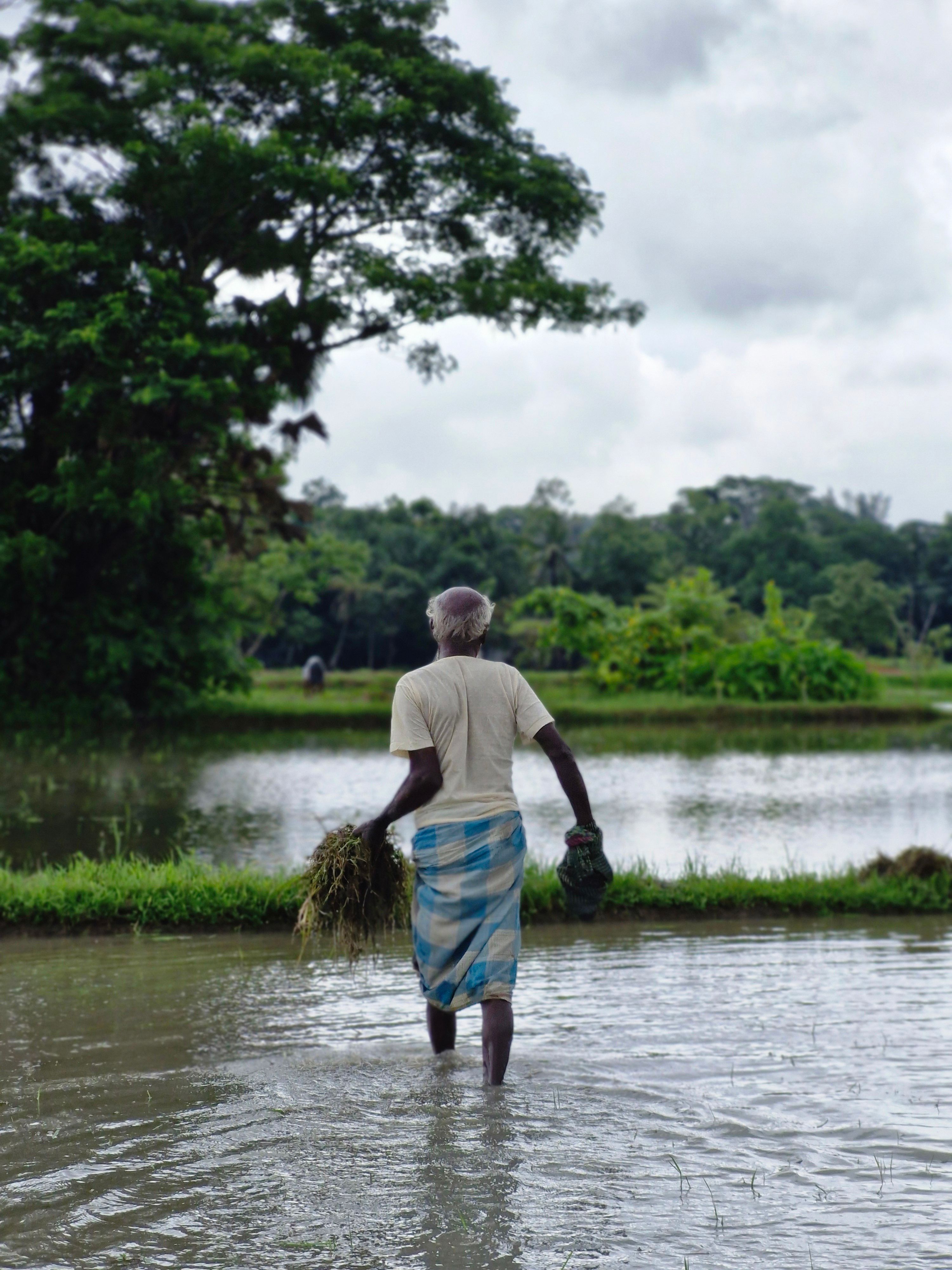 Men Clearing Debris in Flooded Urban Area · Free Stock Photo