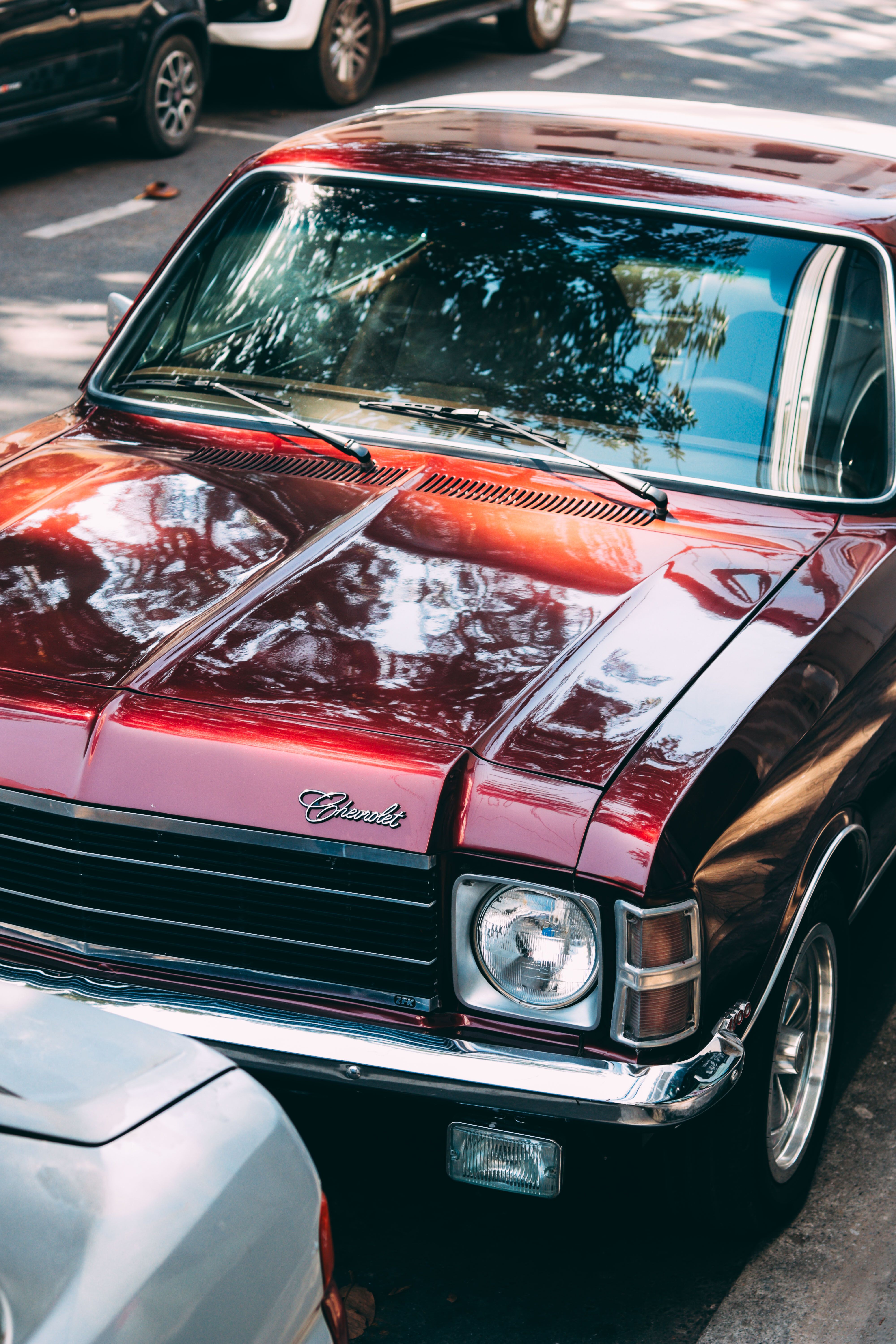 Vintage Red Classic Car Parked on Street · Free Stock Photo
