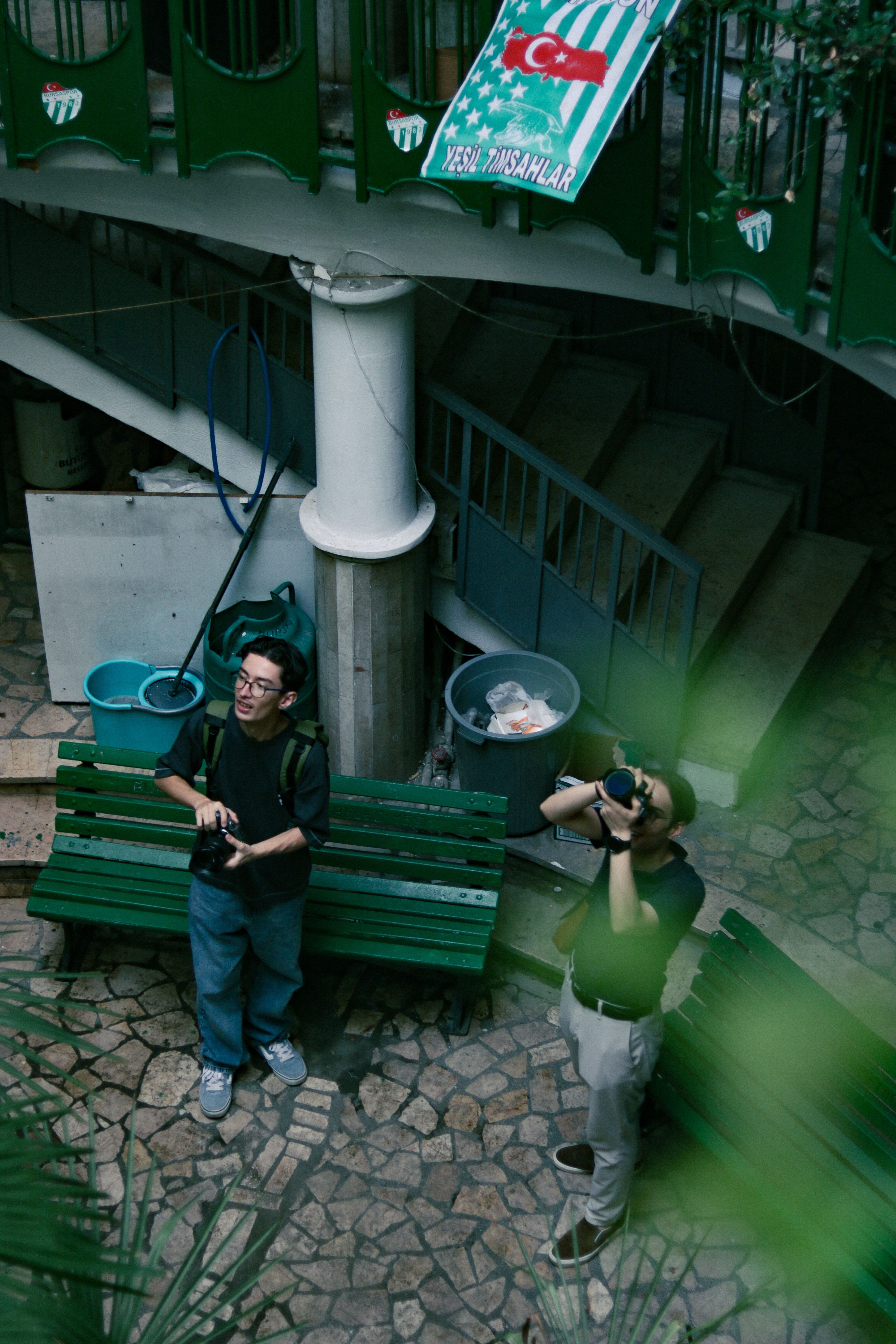 Photographers Capturing Urban Scene from Below · Free Stock Photo