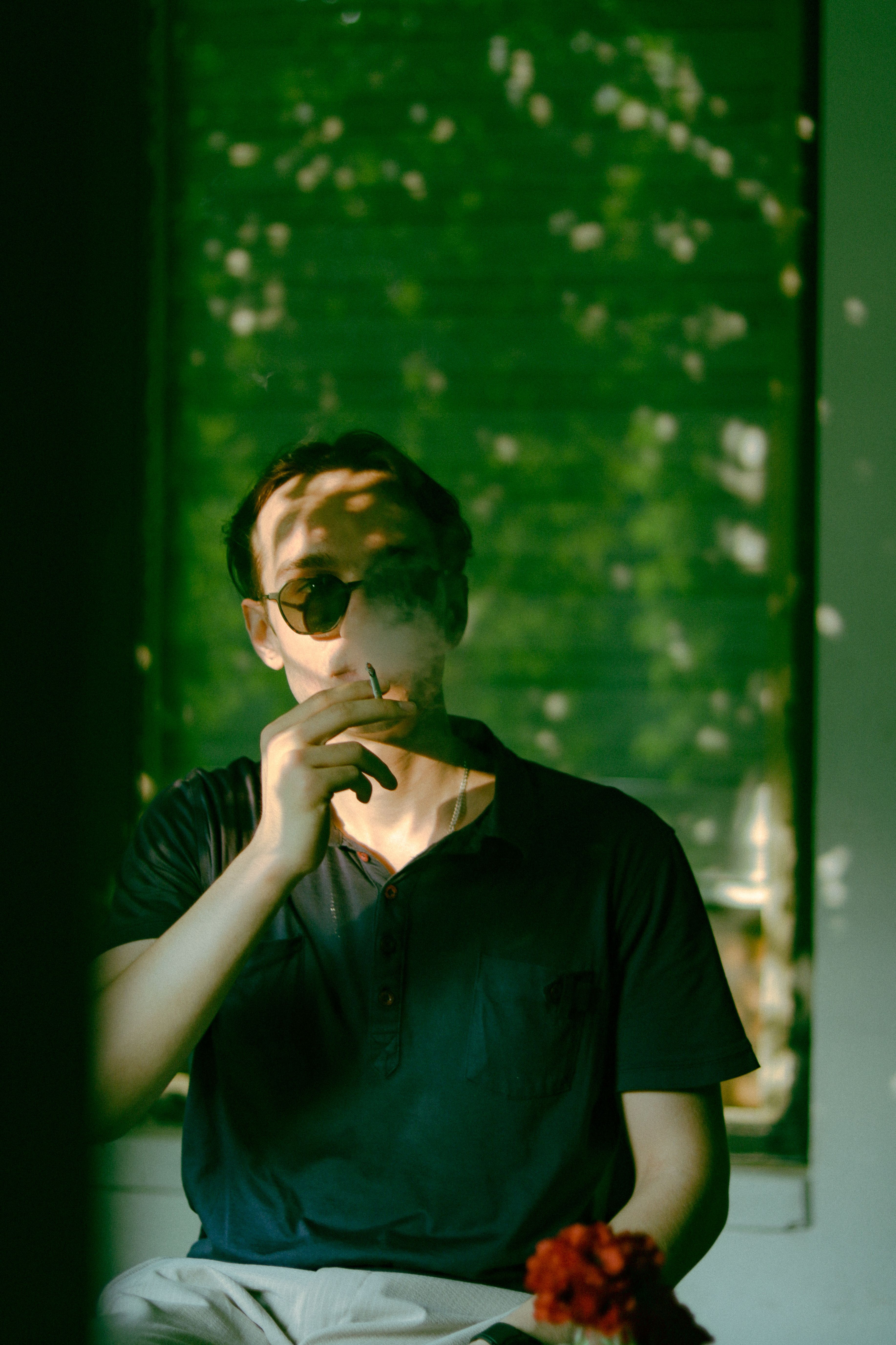Moody Portrait of Man Smoking with Shadows · Free Stock Photo