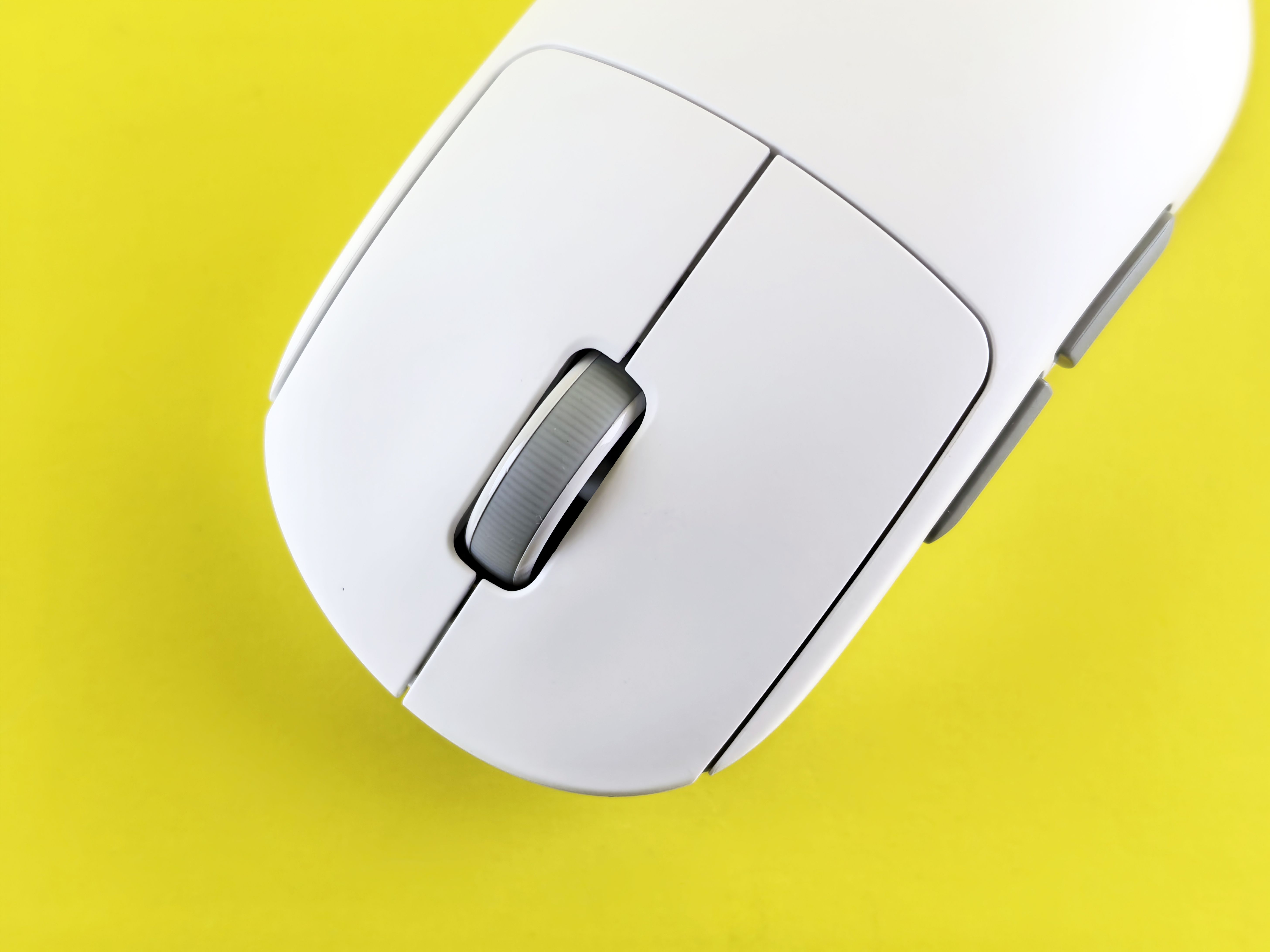 White Wireless Mouse on Bright Yellow Background · Free Stock Photo