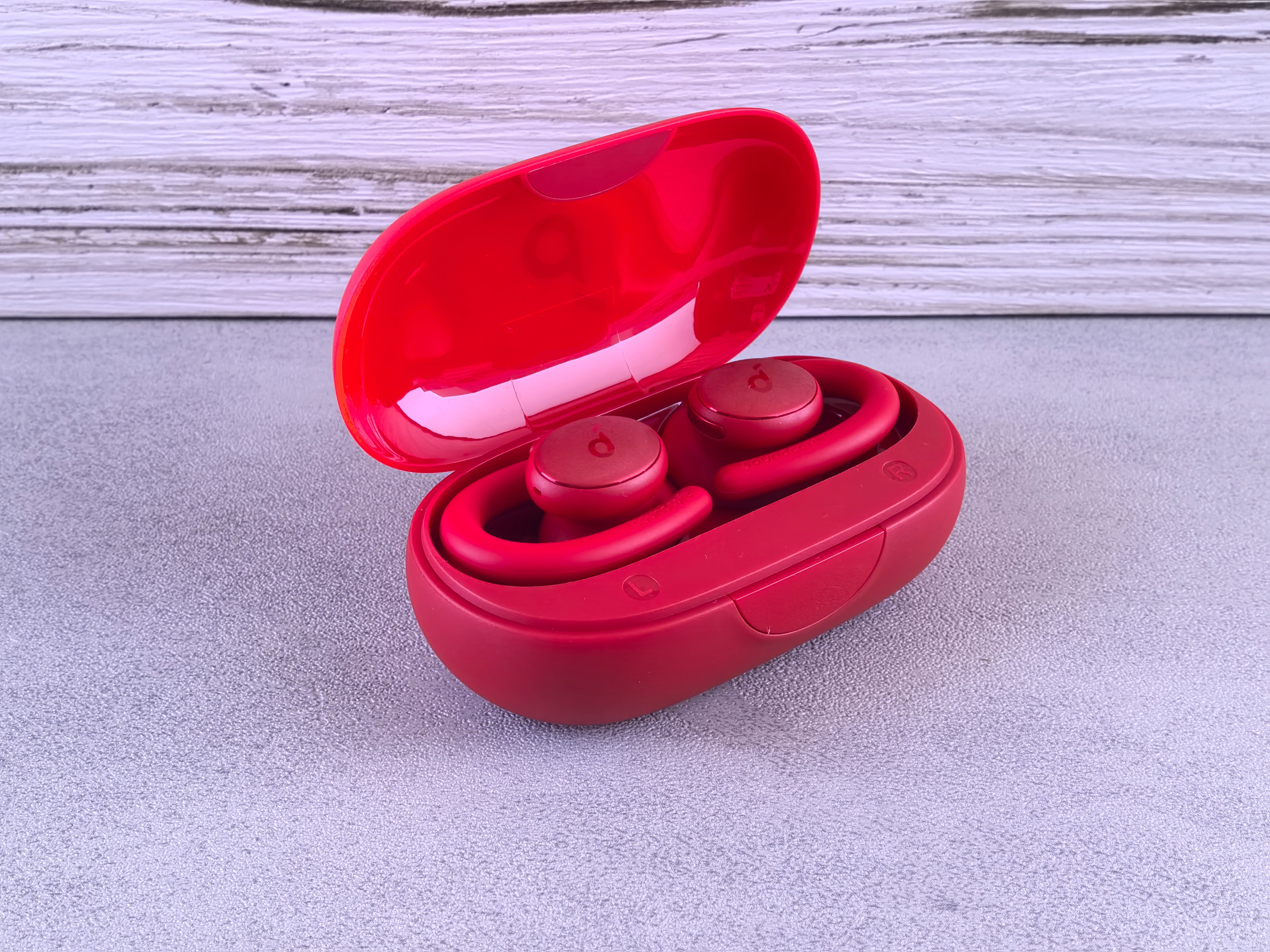 Stylish Red Wireless Earbuds in Charging Case · Free Stock Photo