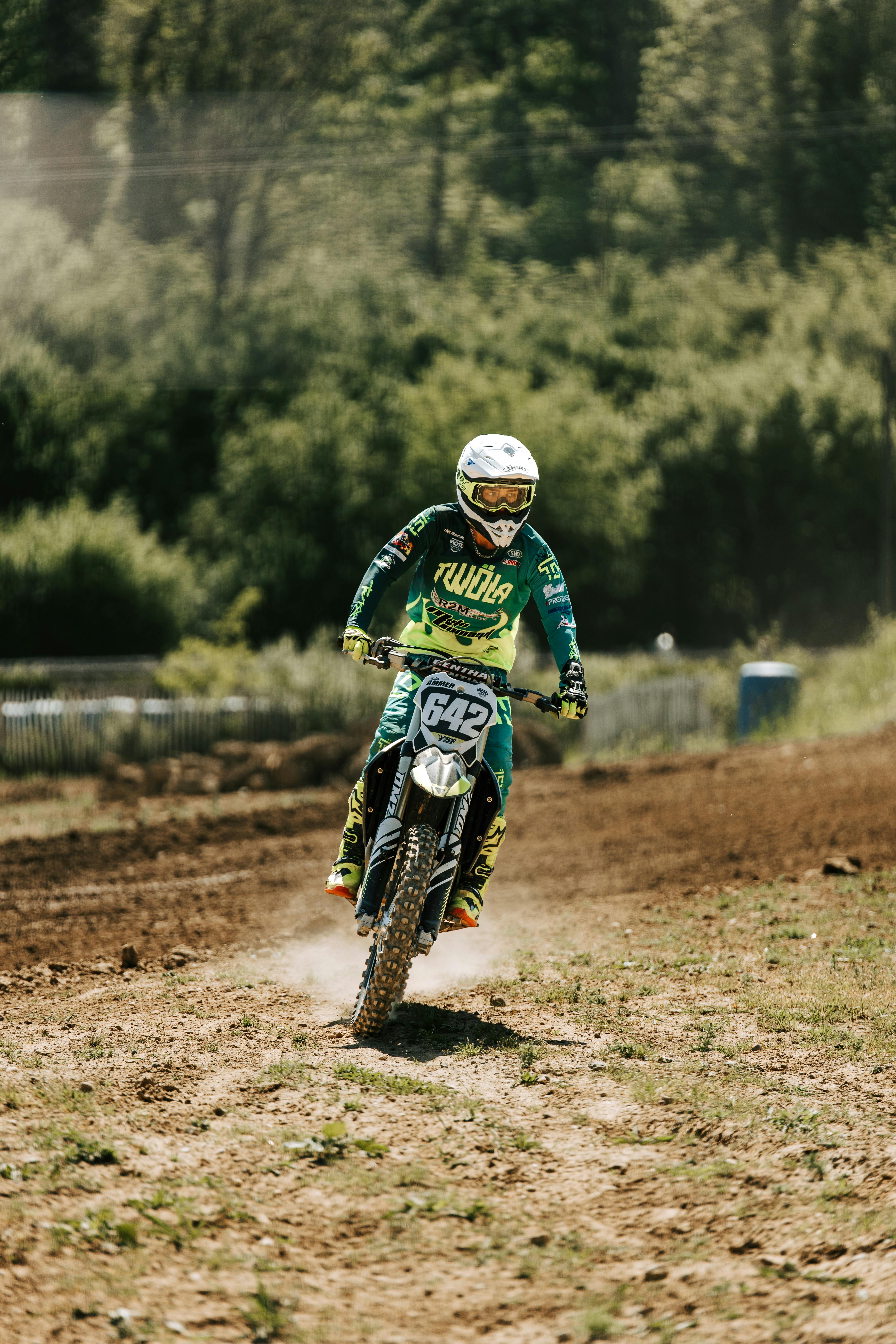 Dynamic Motocross Action on Rugged Terrain · Free Stock Photo
