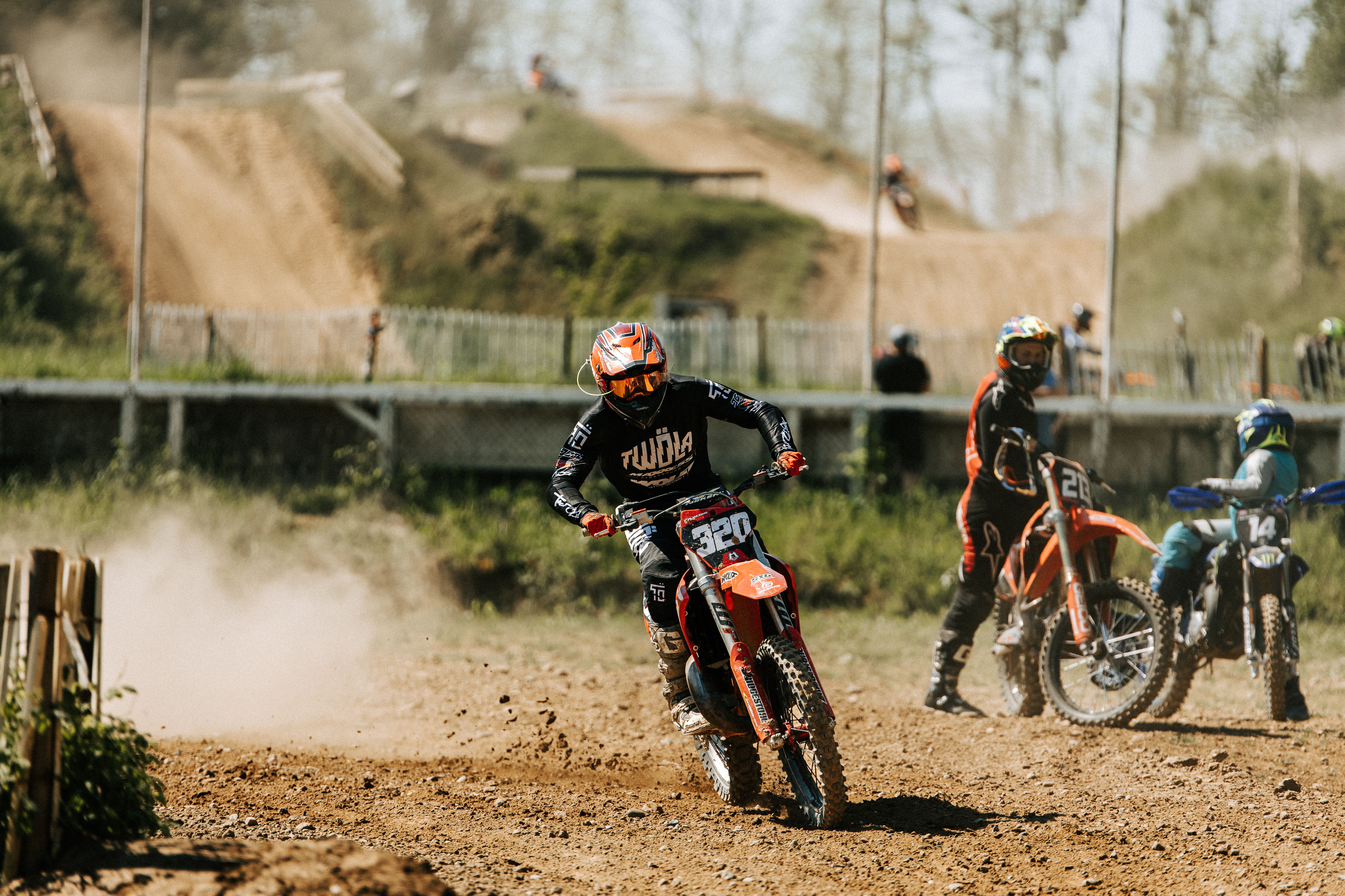 Exciting Motocross Race on a Dusty Track · Free Stock Photo